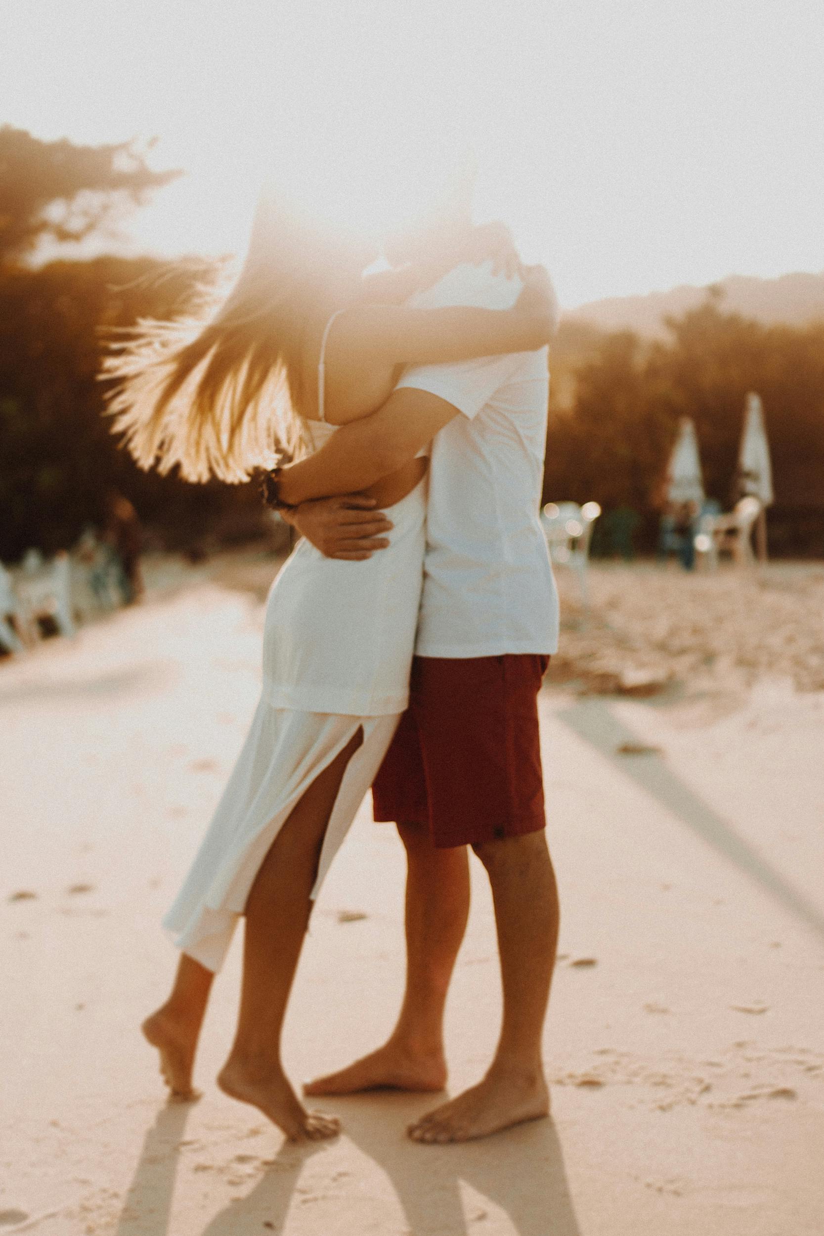 Two People Smiling and Embracing · Free Stock Photo