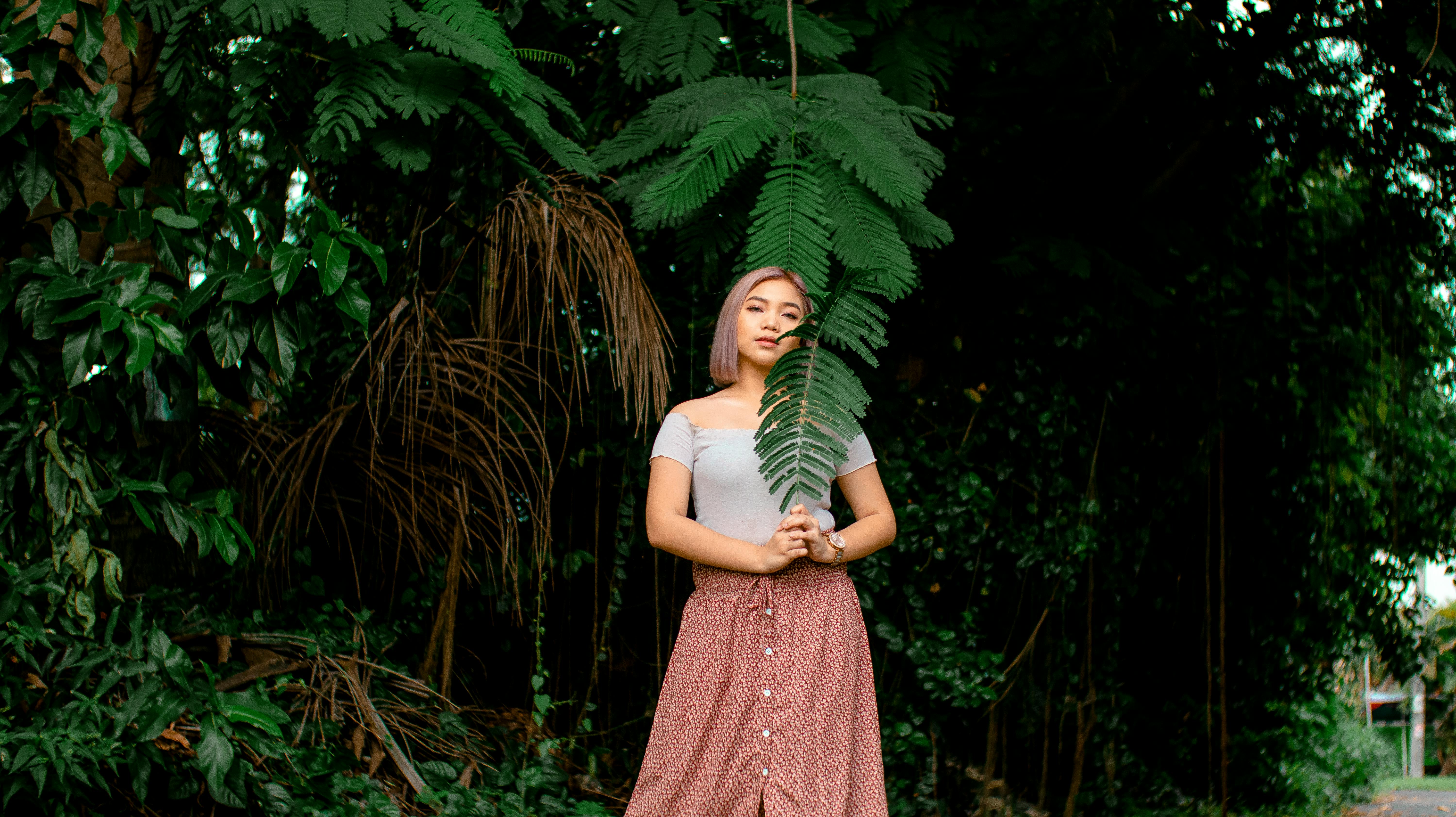 Woman Holding Leaves of a Tree · Free Stock Photo