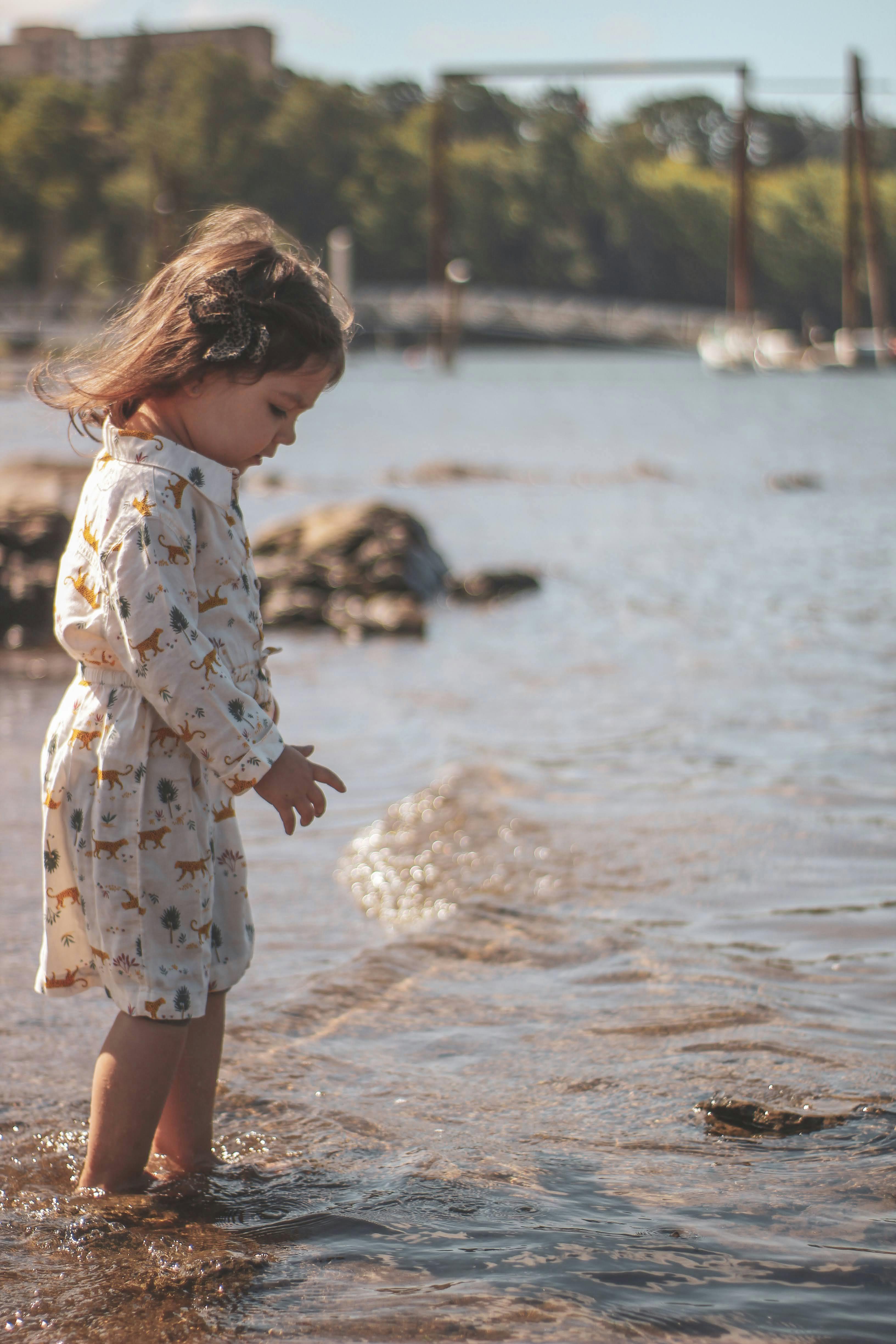 Girl in Dress Standing on Water · Free Stock Photo