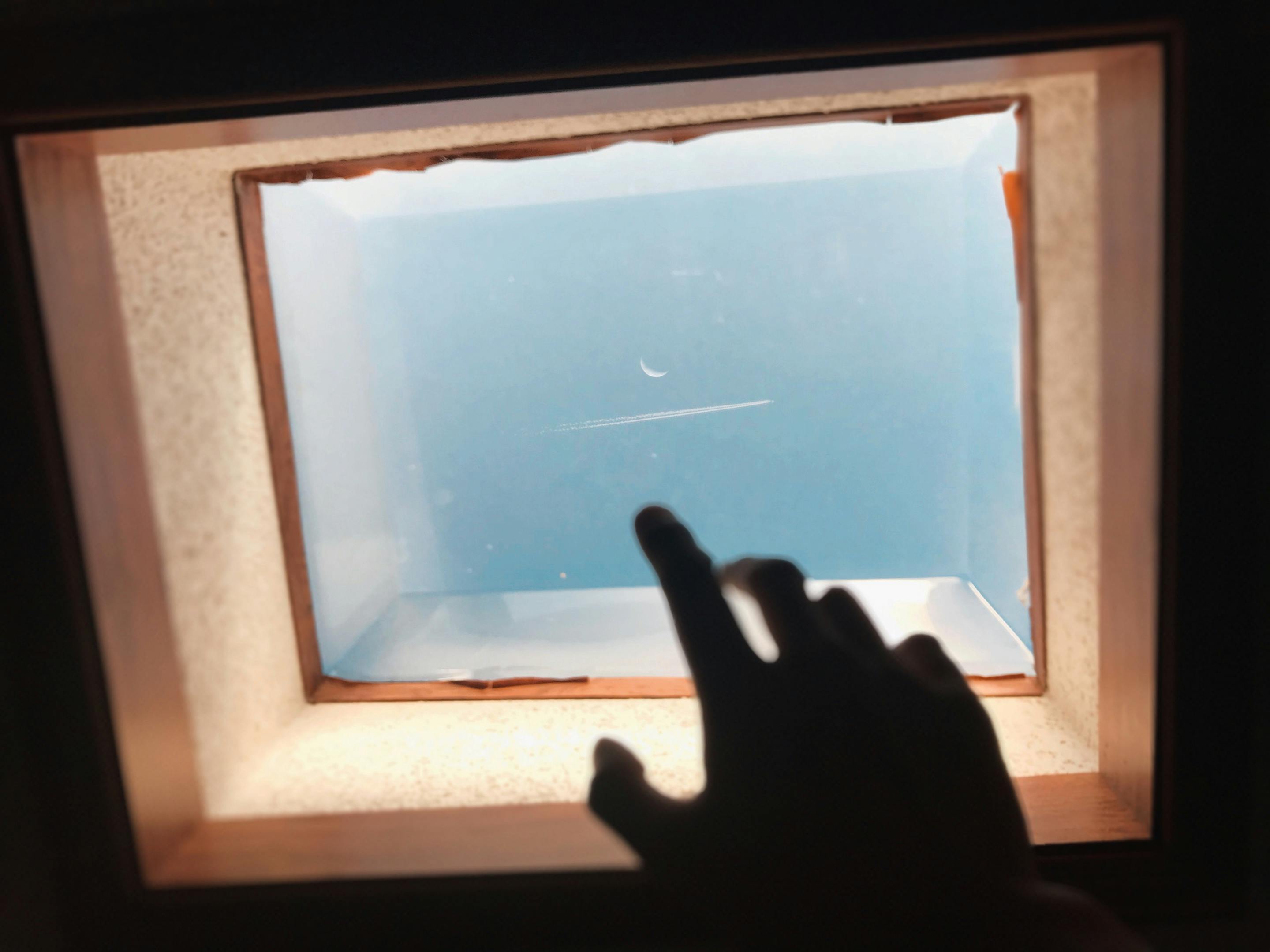 Hand Trying to Reach Window on Ceiling · Free Stock Photo