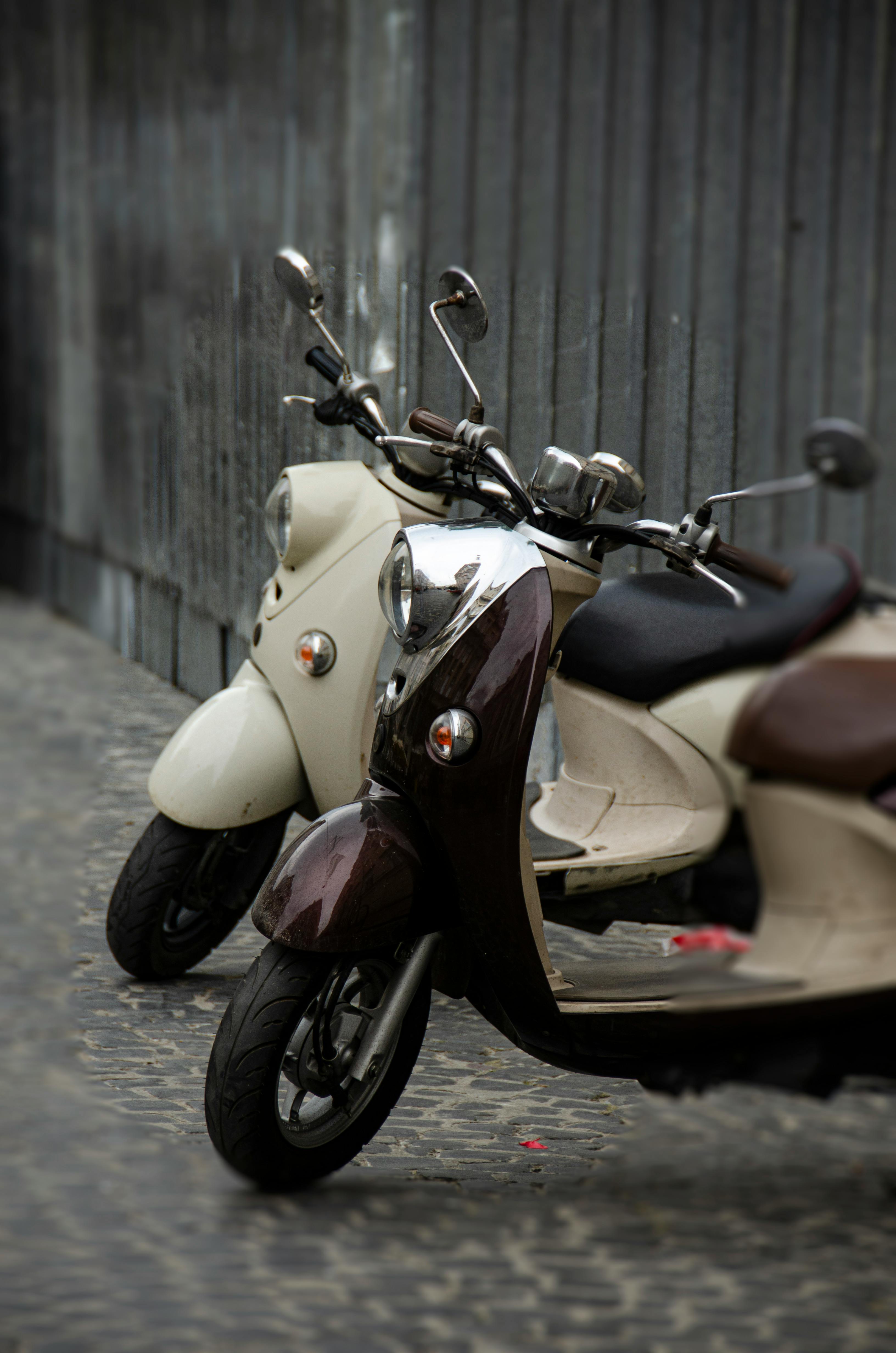 White and Blue Scooter Motorcycles · Free Stock Photo