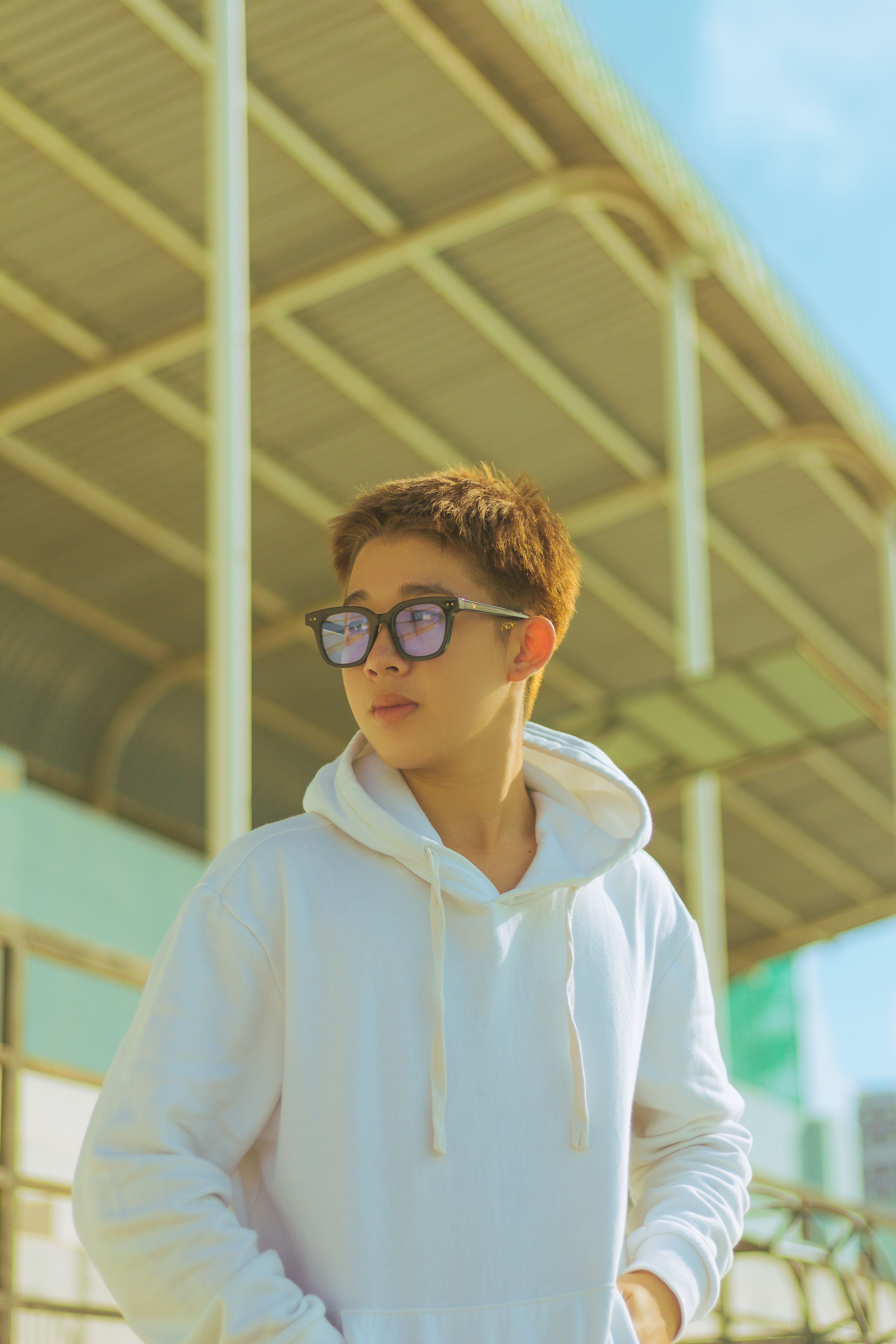 Man Wearing His Purple Hoodie on Purple Background · Free Stock Photo