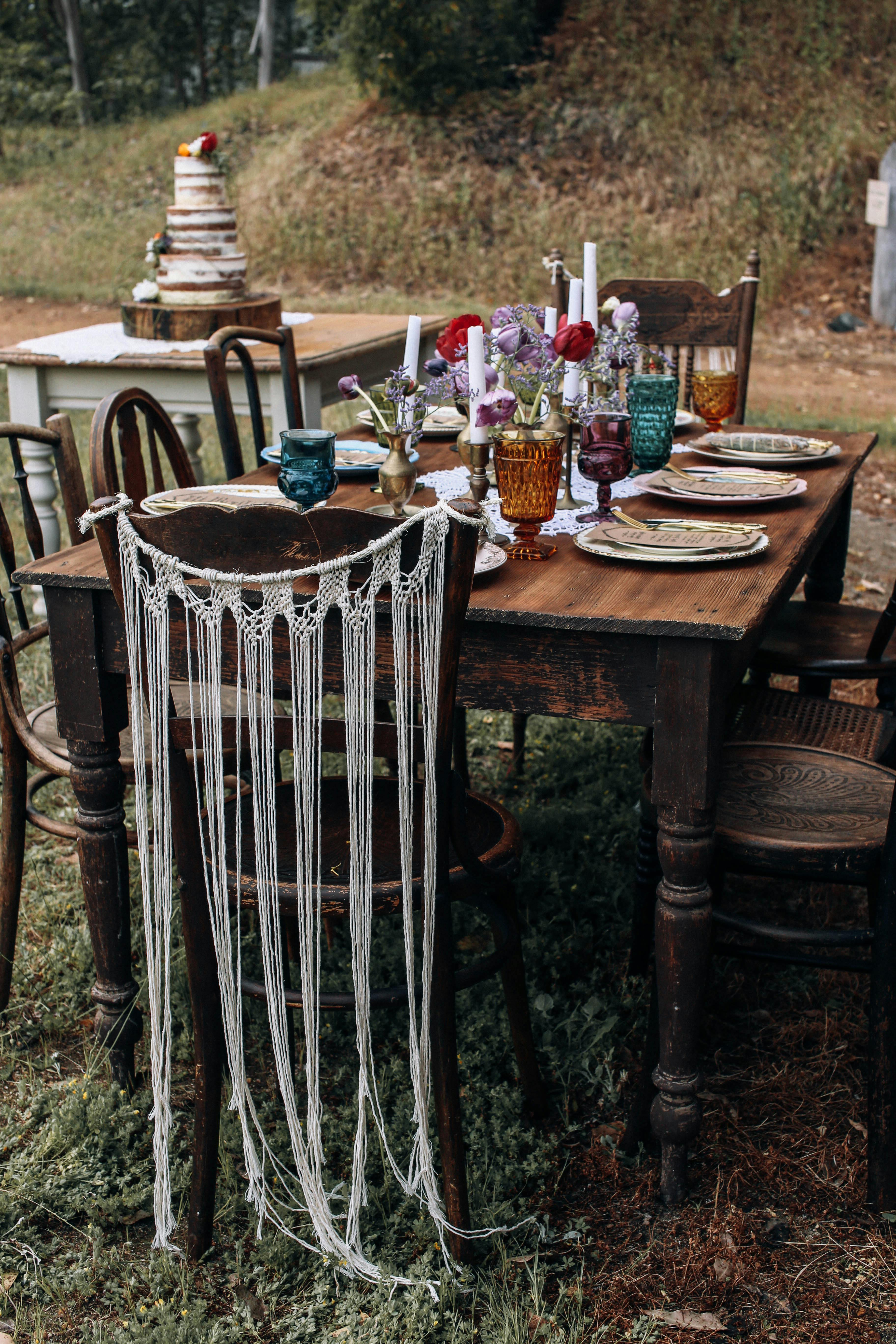 Brown Burlap Wrapped Party Favors on Brown Wooden Rack · Free Stock Photo