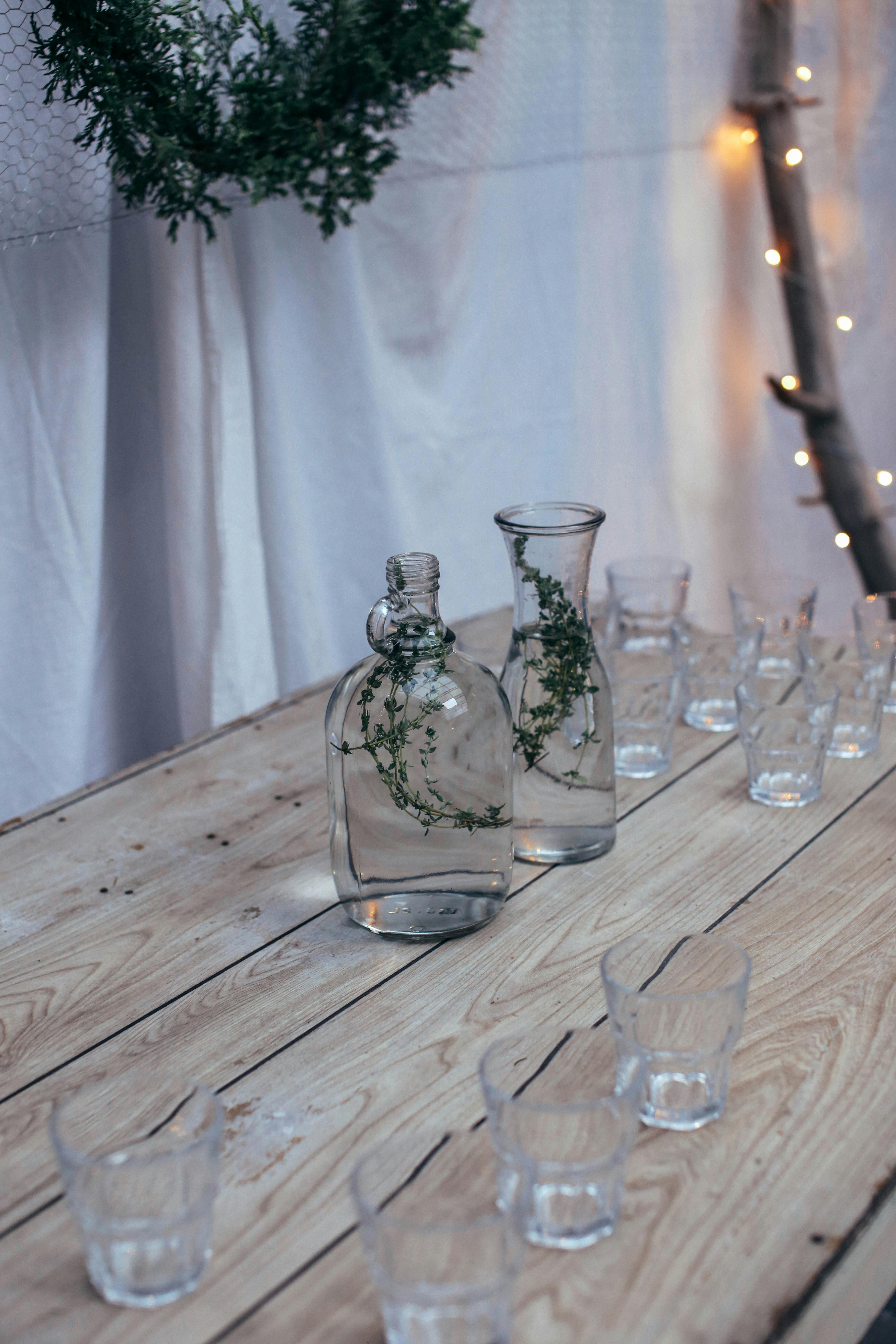 Banquet table with glassware and decoration on walls · Free Stock Photo