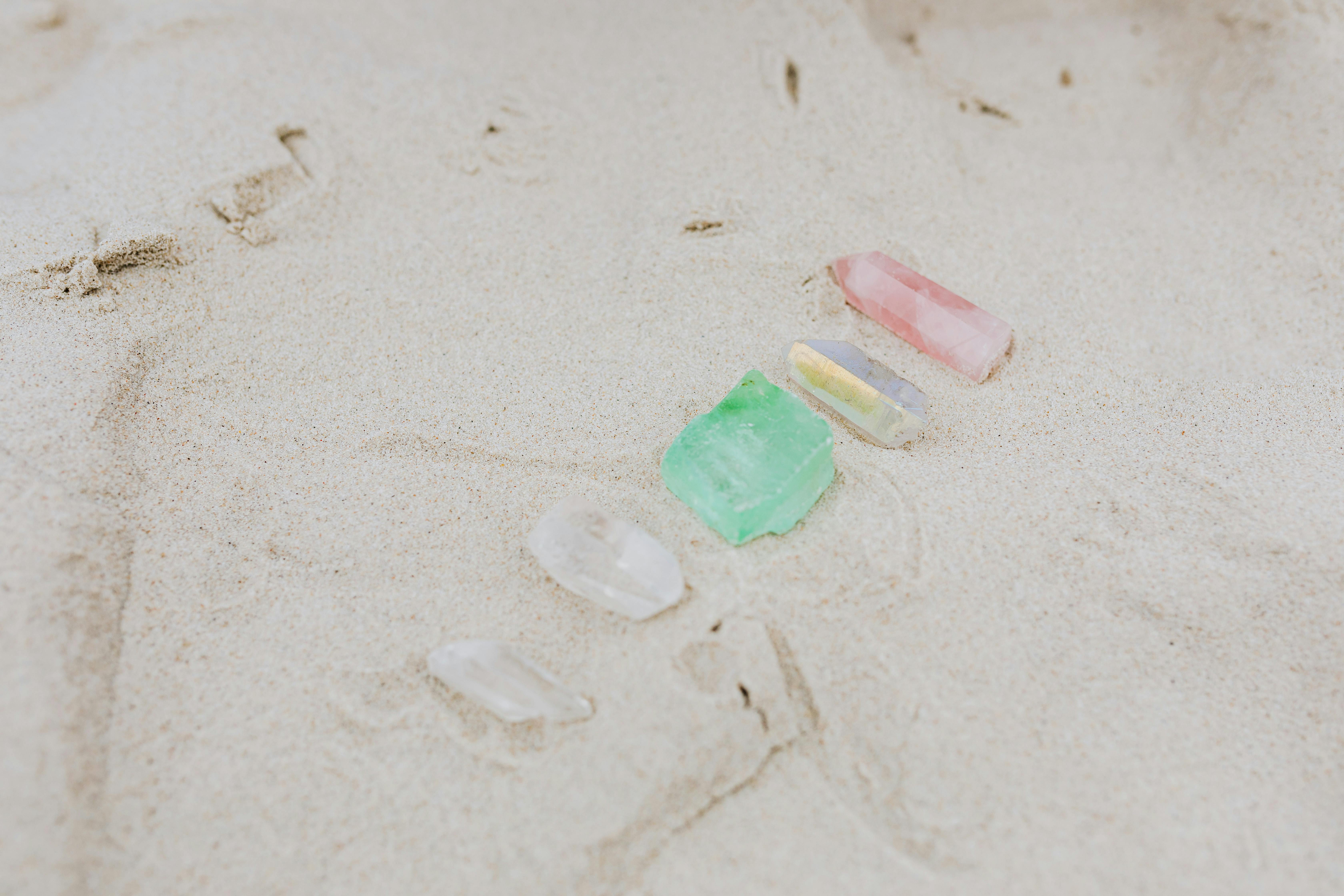 Close-Up Shot of Crystals on the Sand · Free Stock Photo