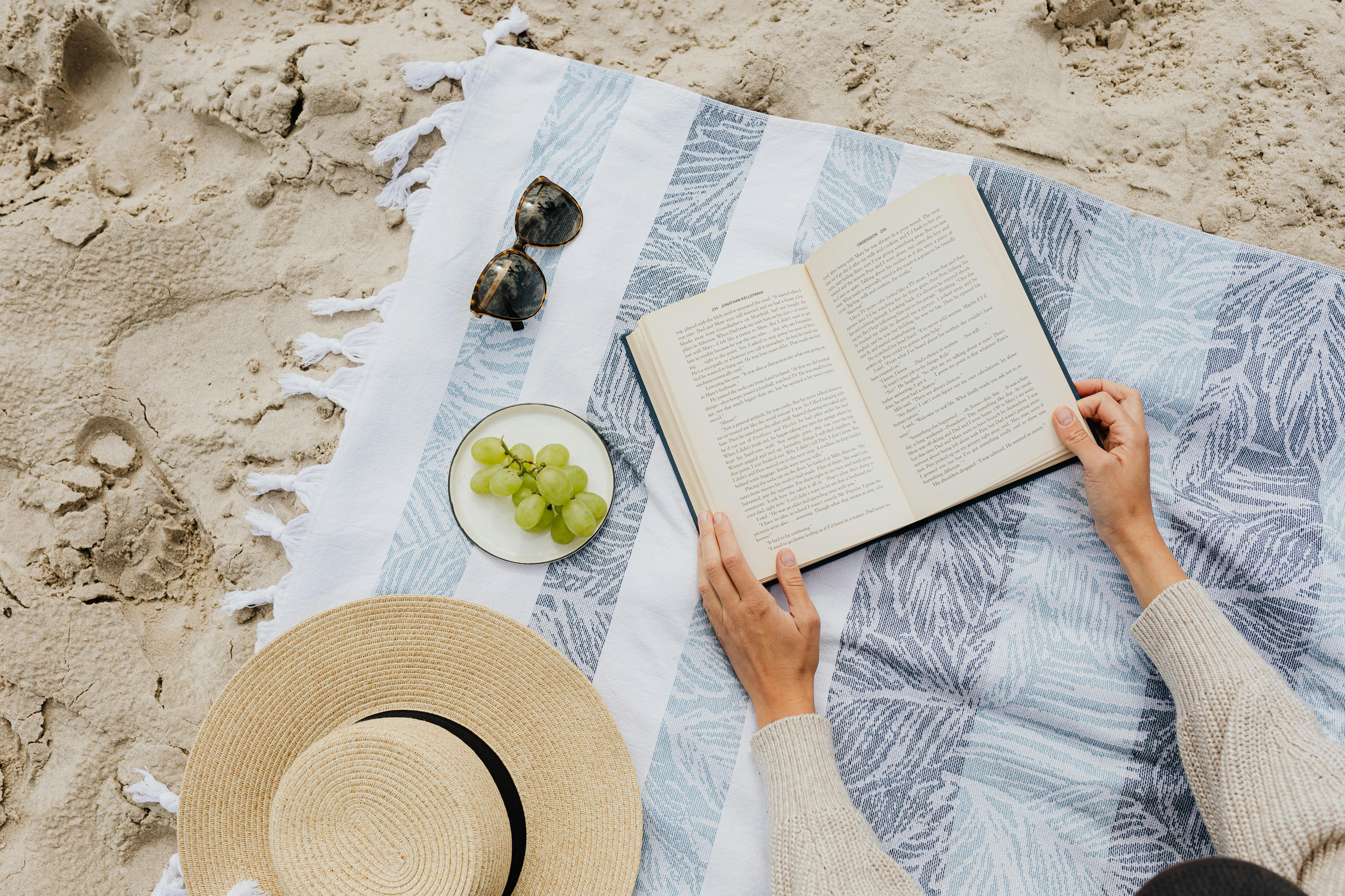 Reading a Book at the Beach · Free Stock Photo