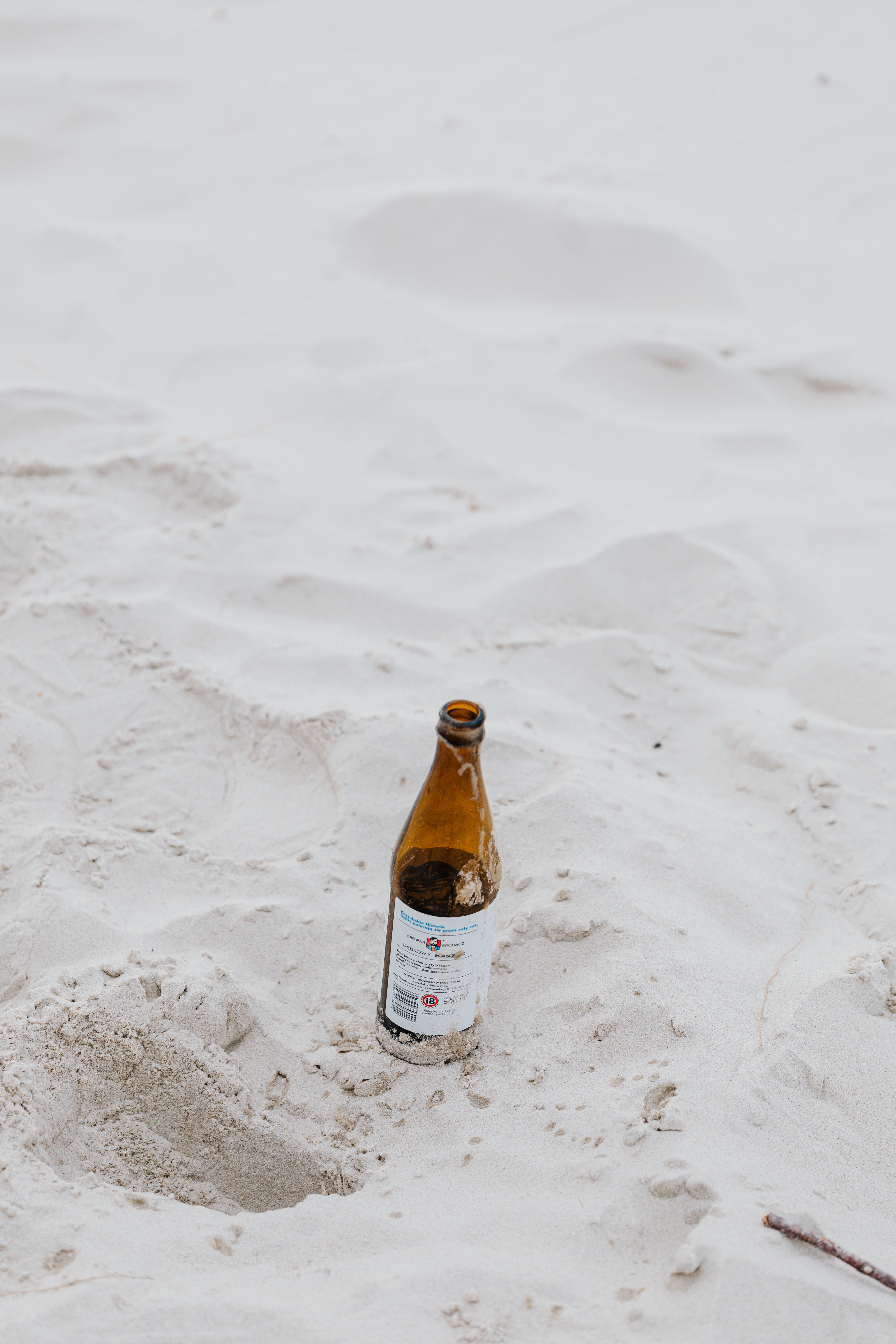Photo of a Beer on the Sand · Free Stock Photo