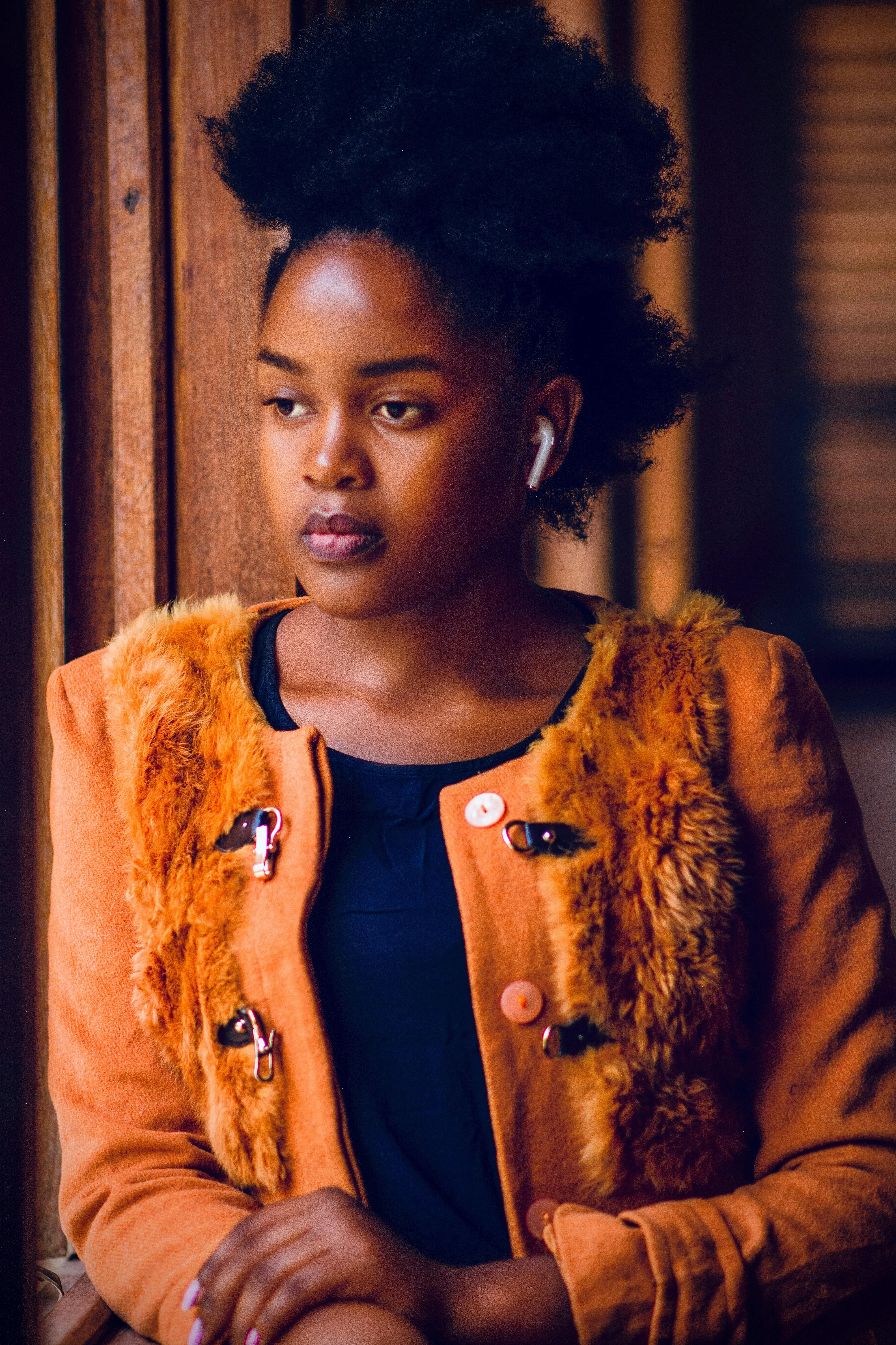 Woman Looking Afar While Holding a Cardboard · Free Stock Photo