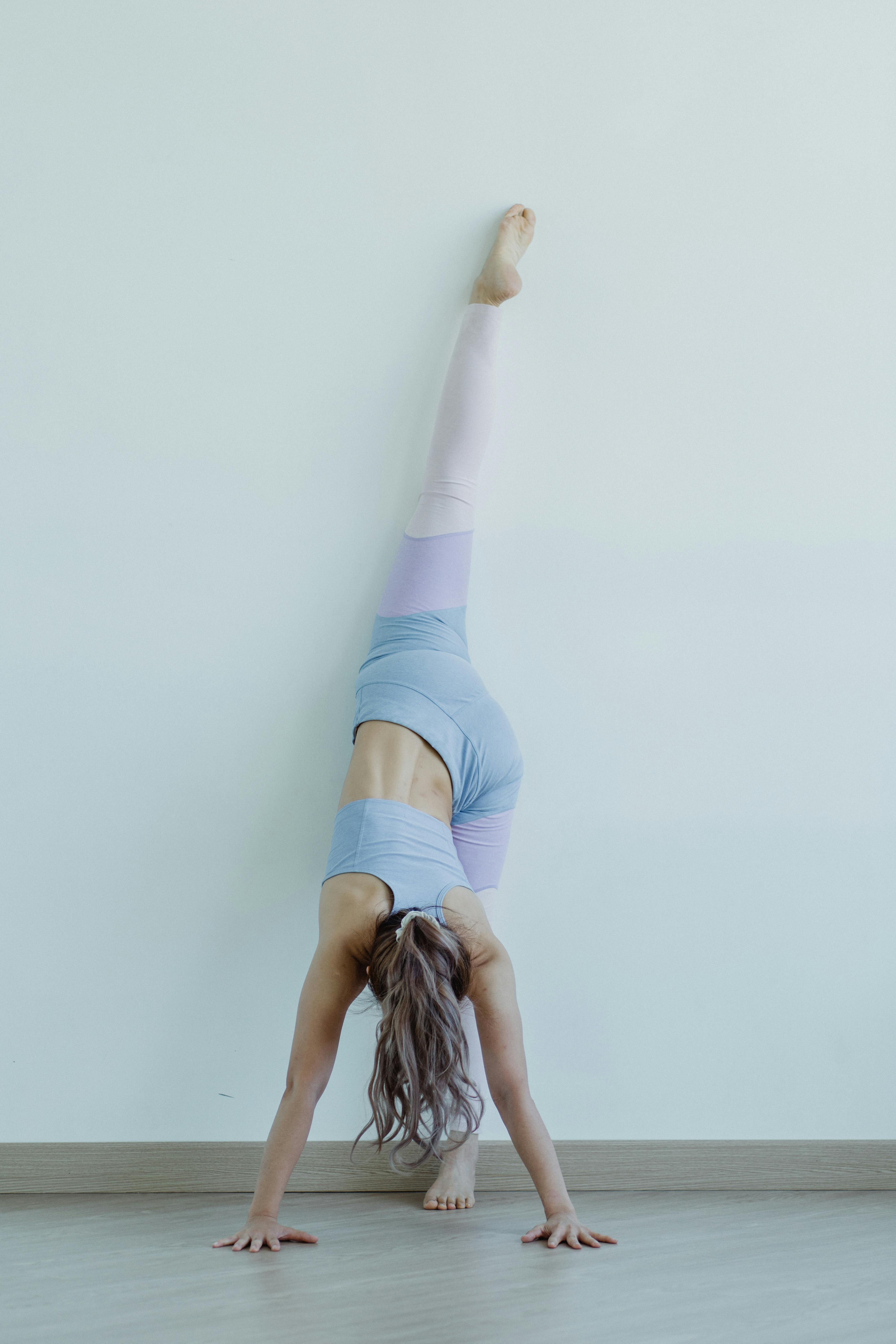 Woman in Sportswear Doing a Handstand · Free Stock Photo