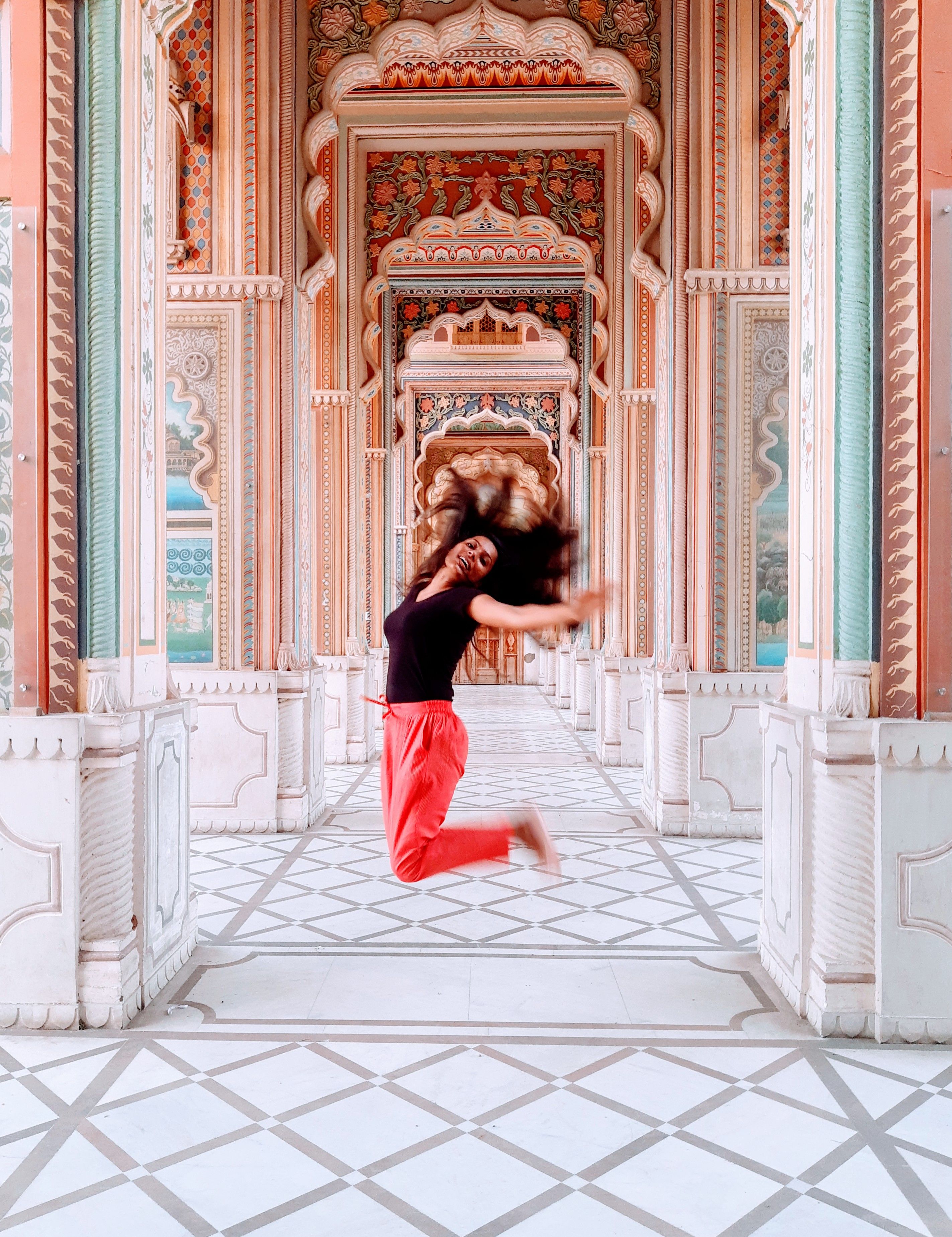 People Walking Between Ornate Columns · Free Stock Photo