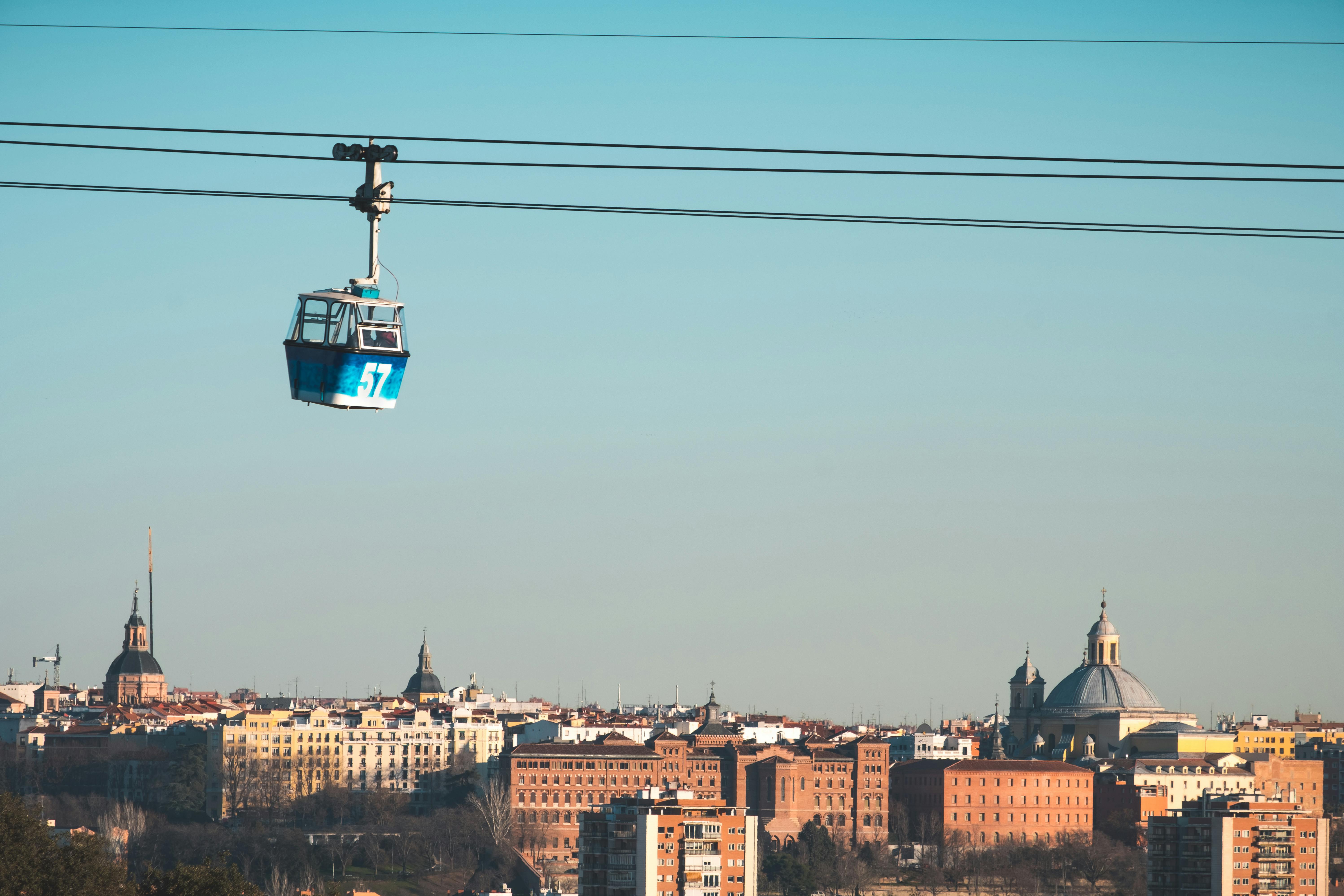 Cable Car over City Buildings · Free Stock Photo