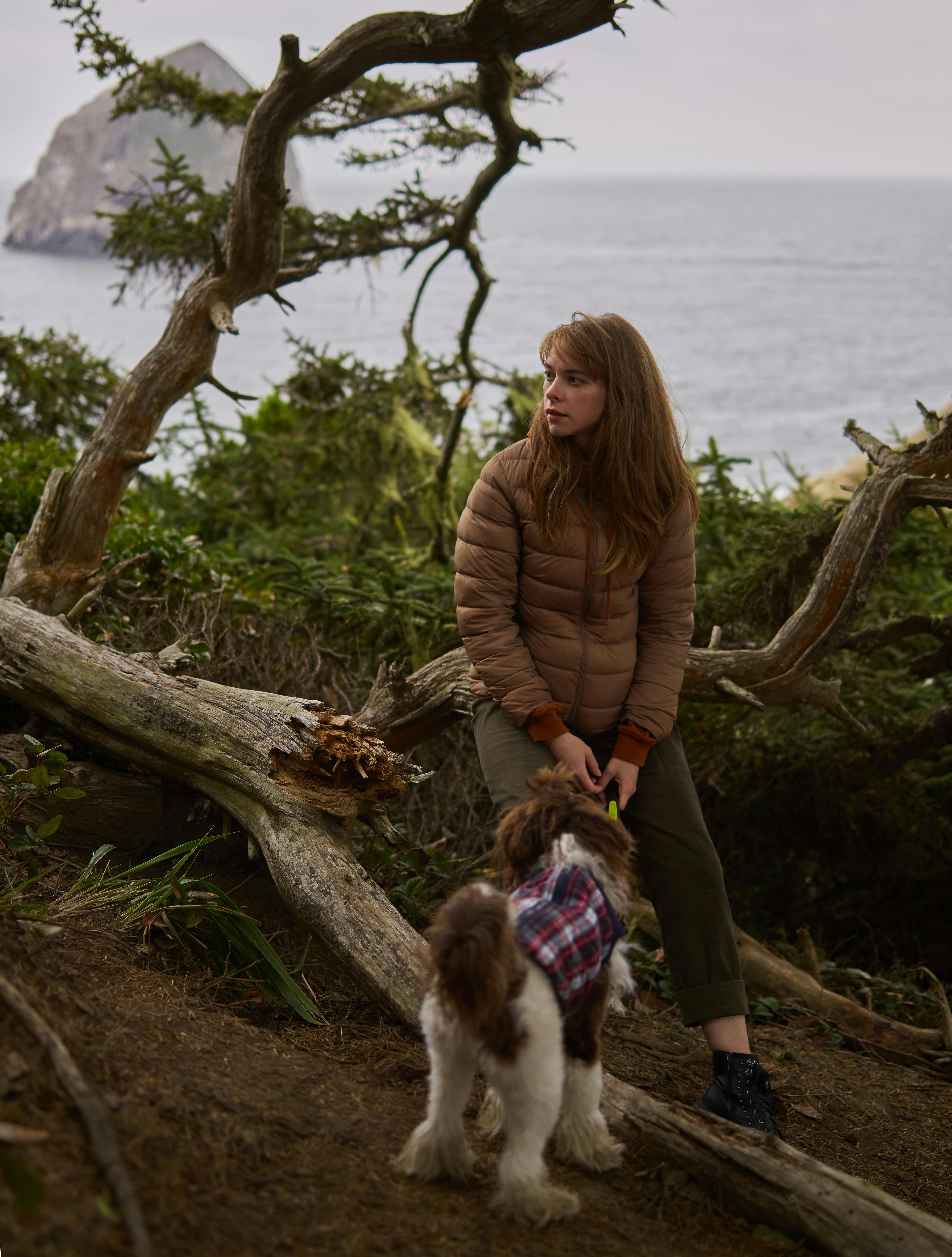 A Woman Sitting on a Tree Branch · Free Stock Photo