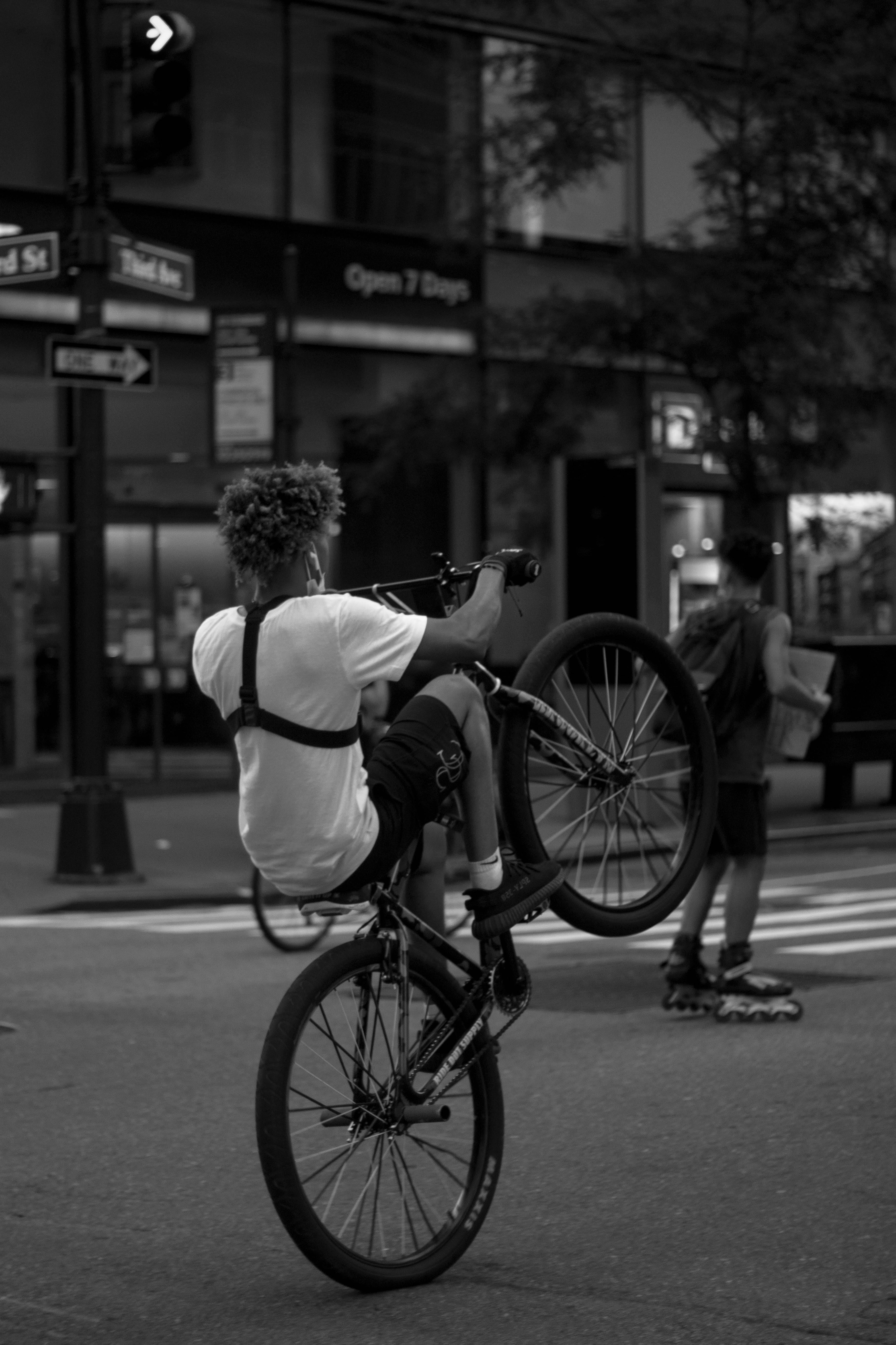 A Man Riding Fixie doing Wheelie · Free Stock Photo