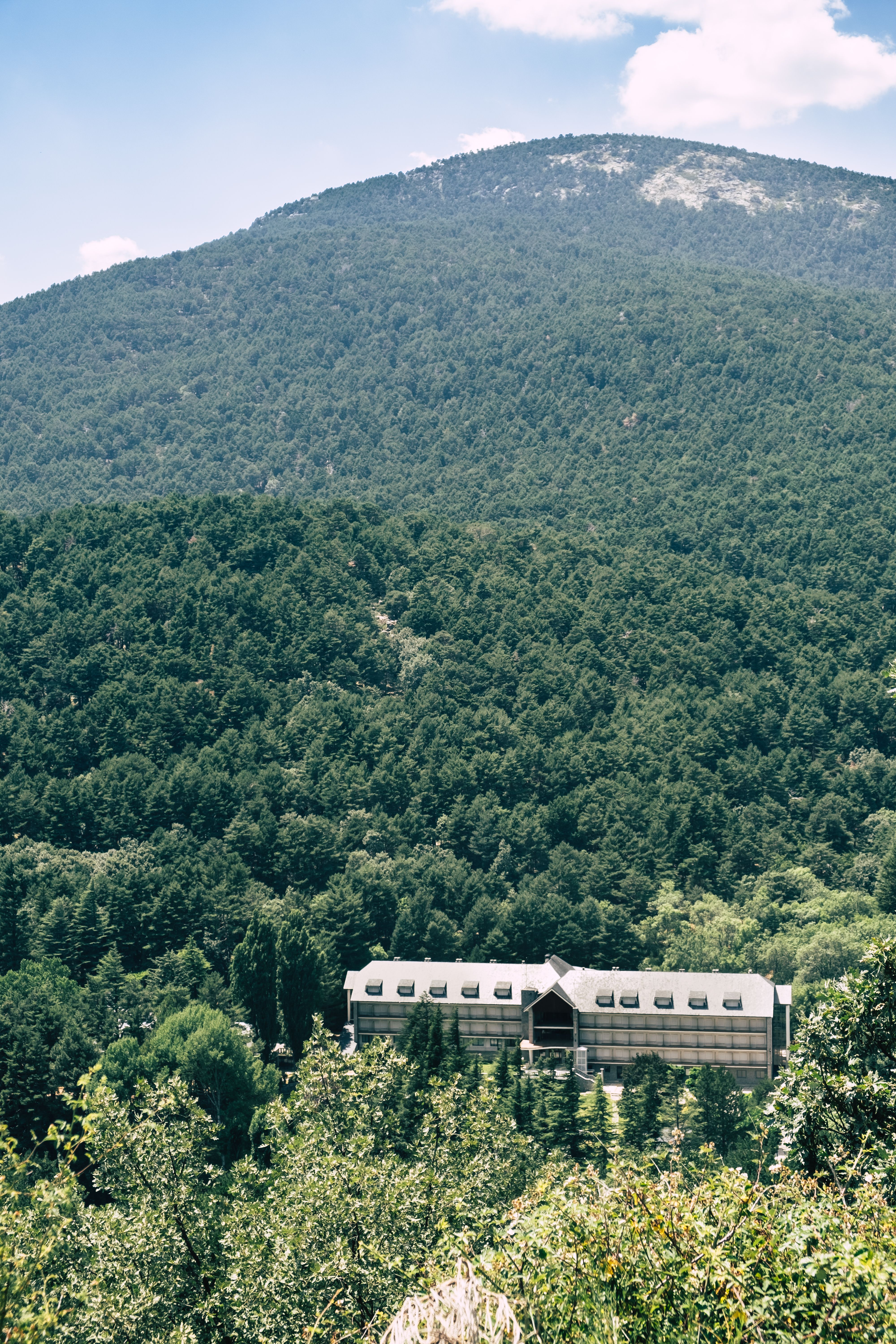 Landscape with Hills and a Building in Forest · Free Stock Photo