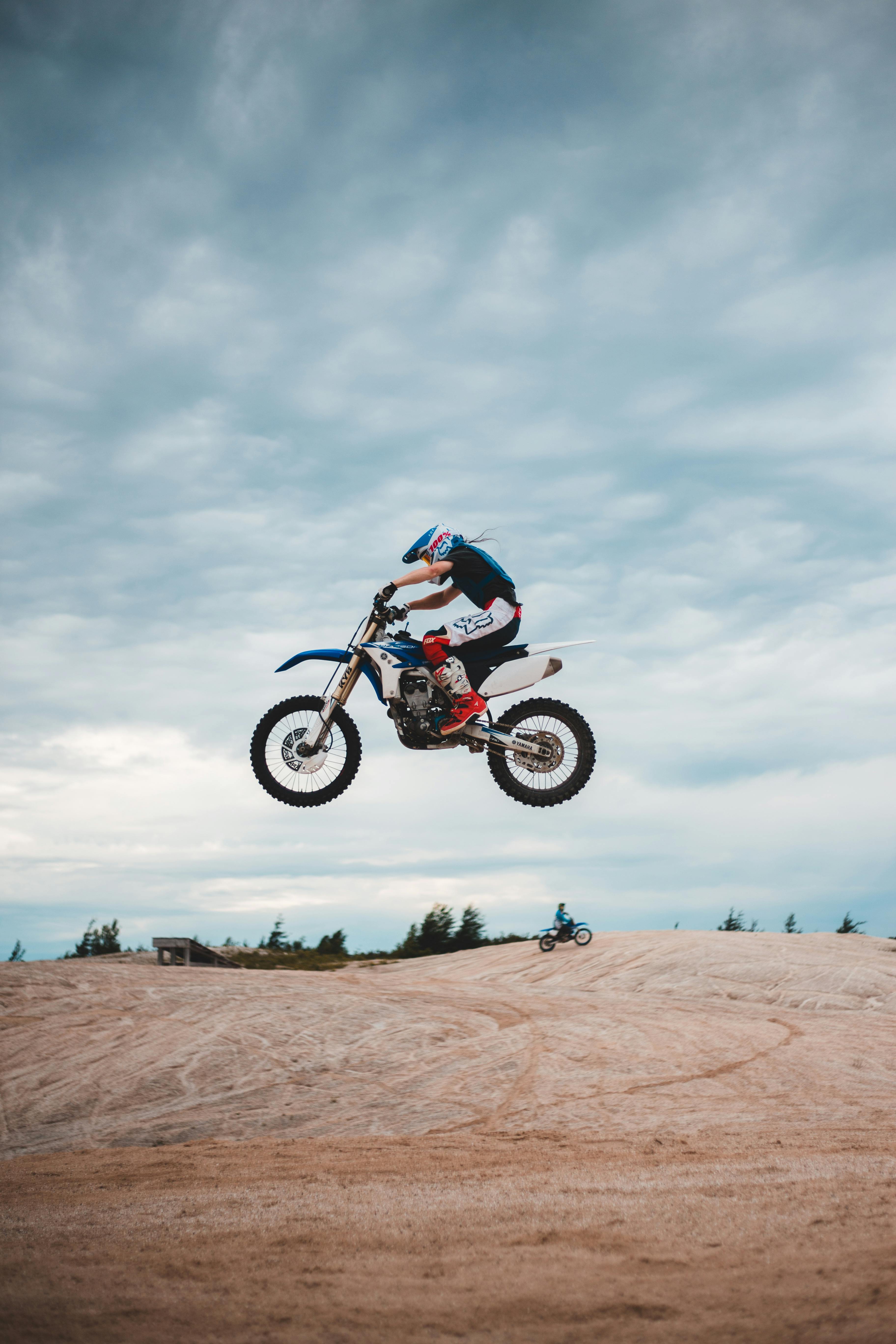 Unrecognizable biker doing trick in air · Free Stock Photo