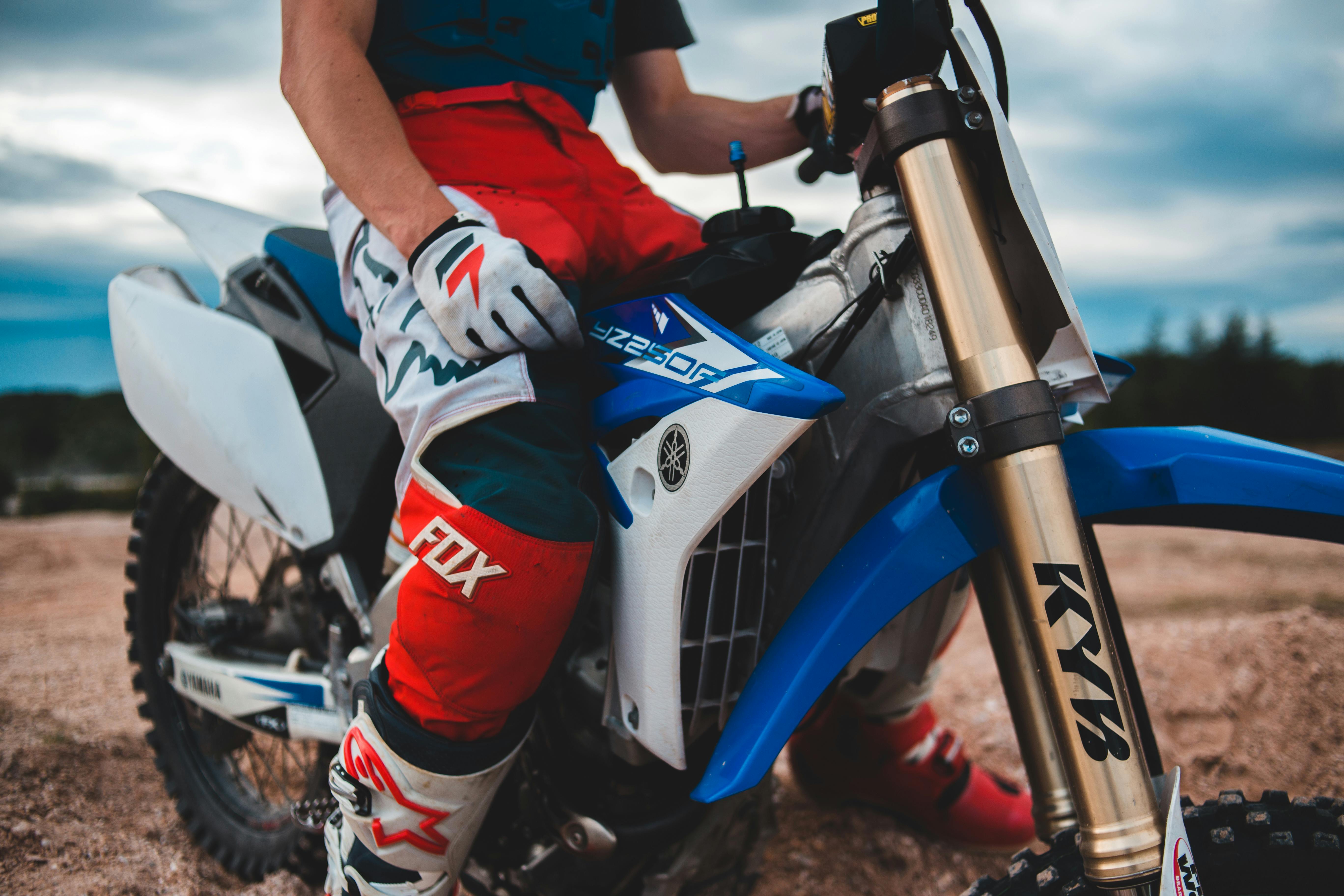 Crop man sitting on enduro motorcycle · Free Stock Photo