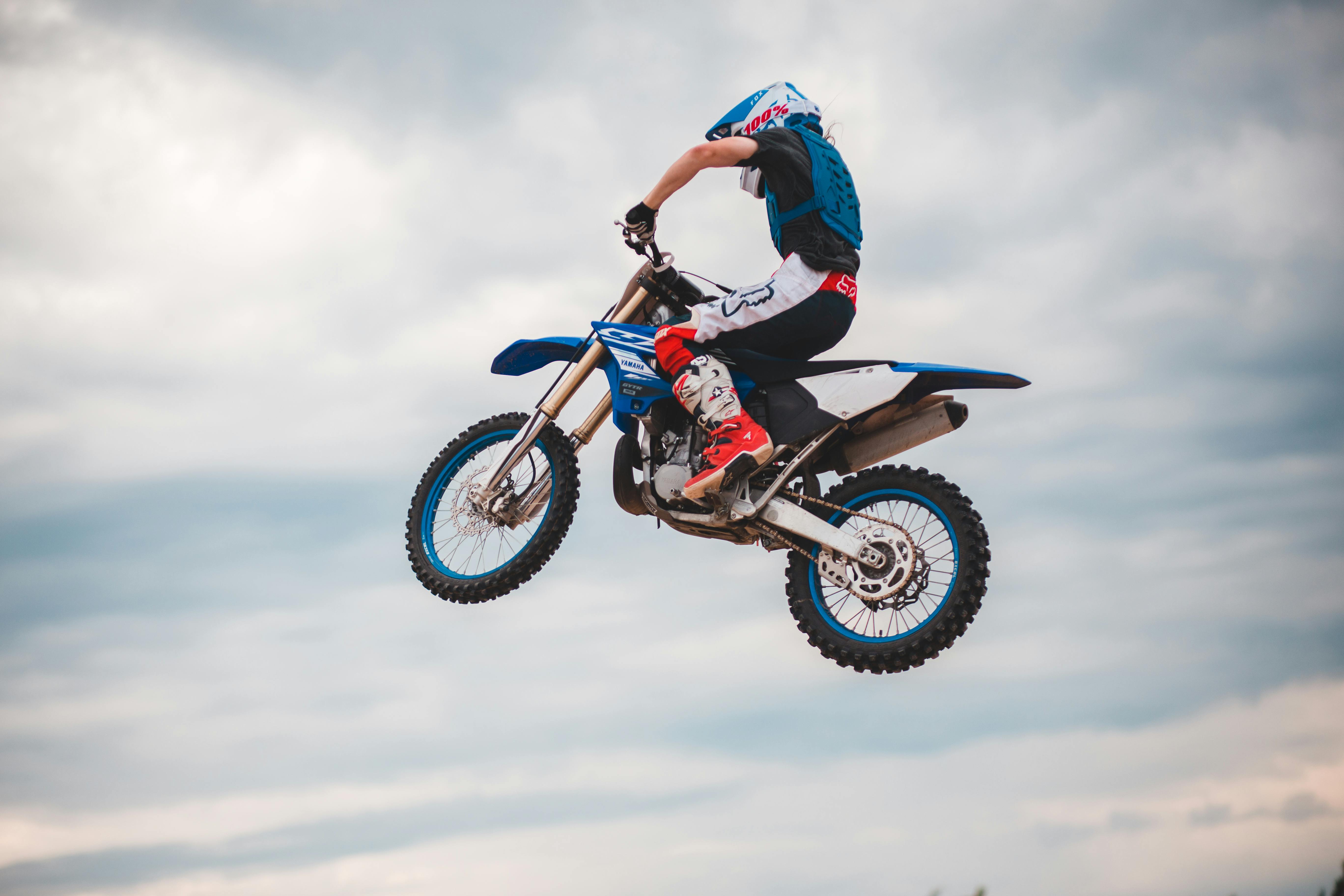 Unrecognizable man rider performing stunt in air · Free Stock Photo