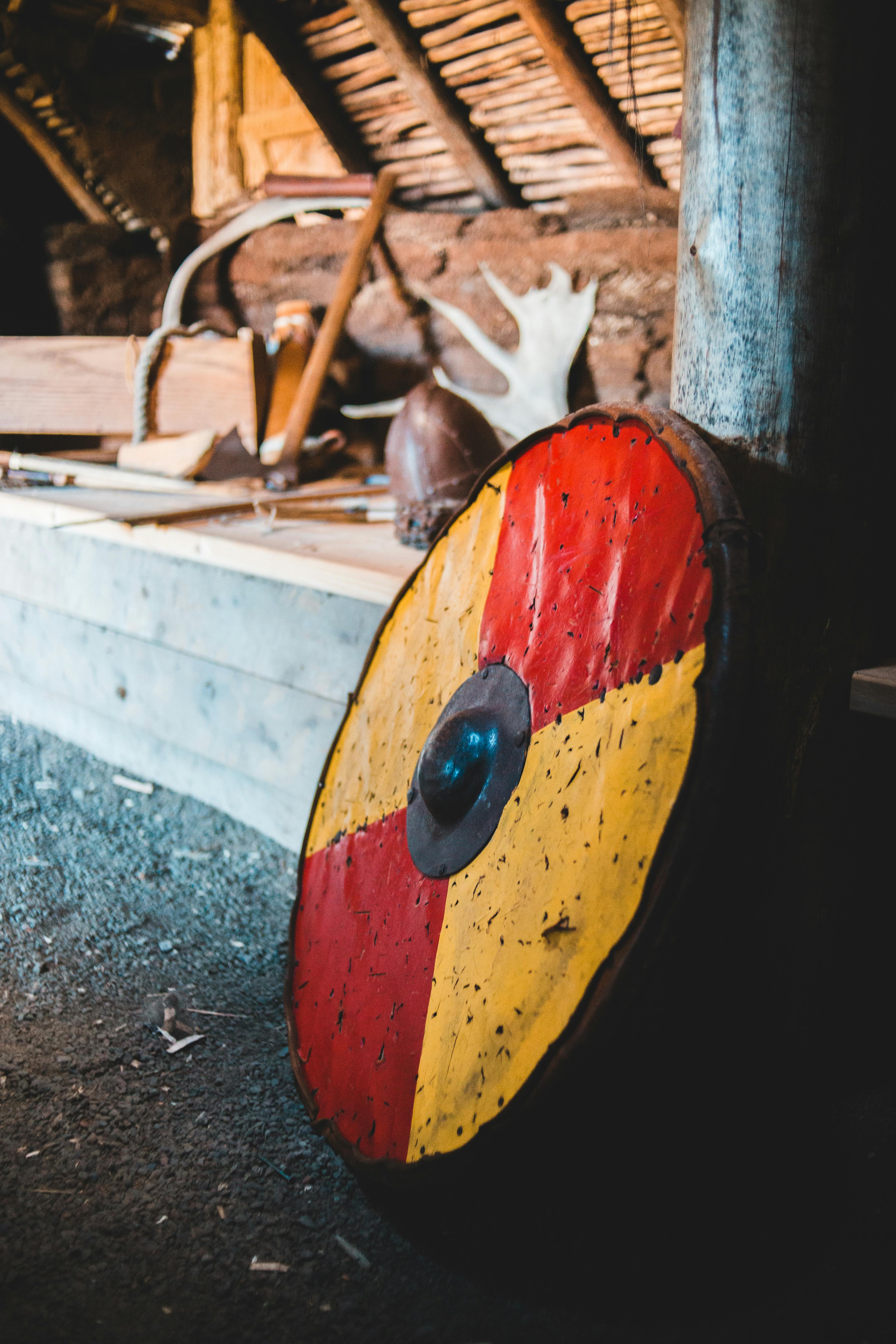 Weathered old Viking shield in rural house · Free Stock Photo
