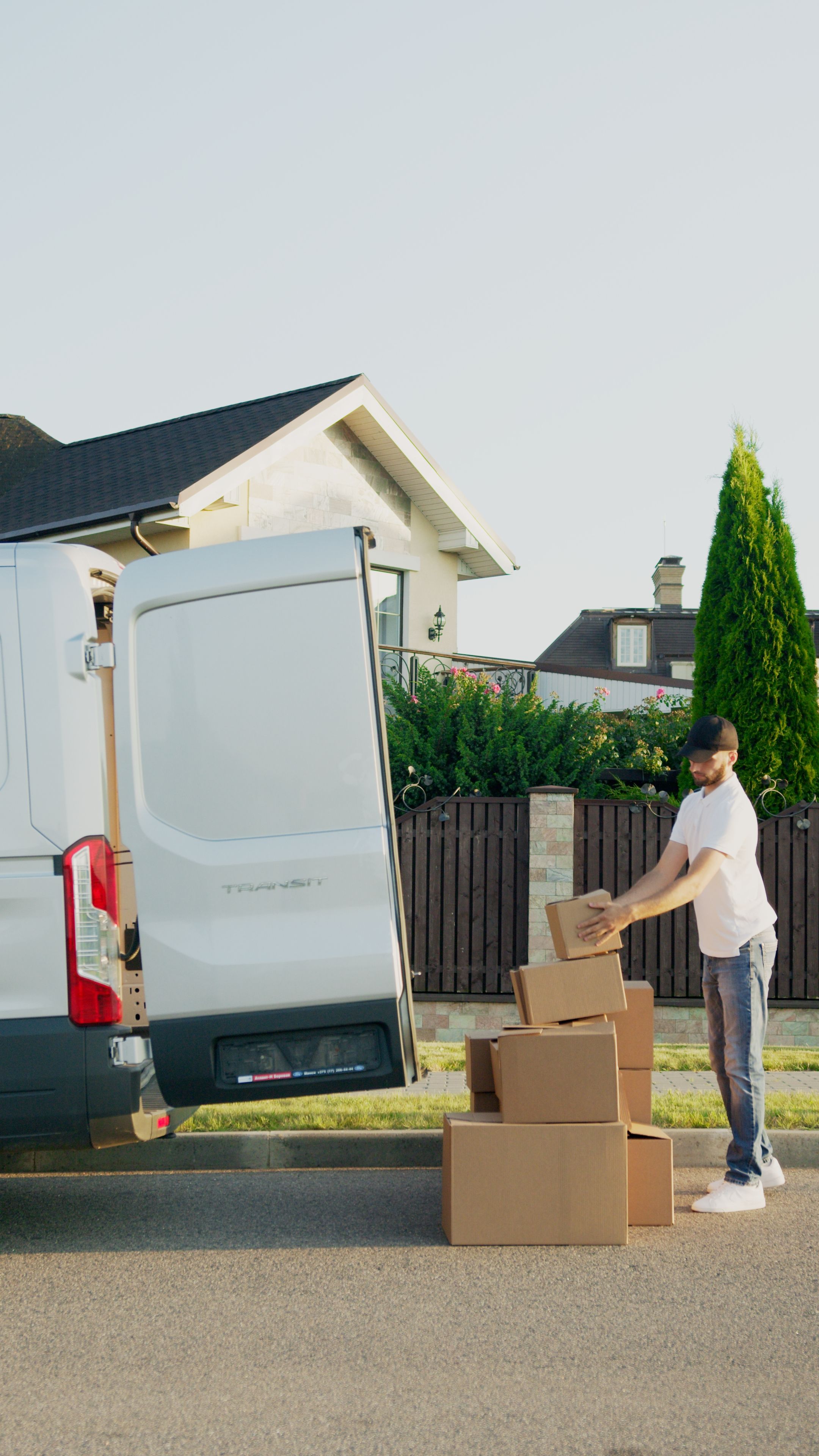 A Man Standing Near the Van · Free Stock Photo