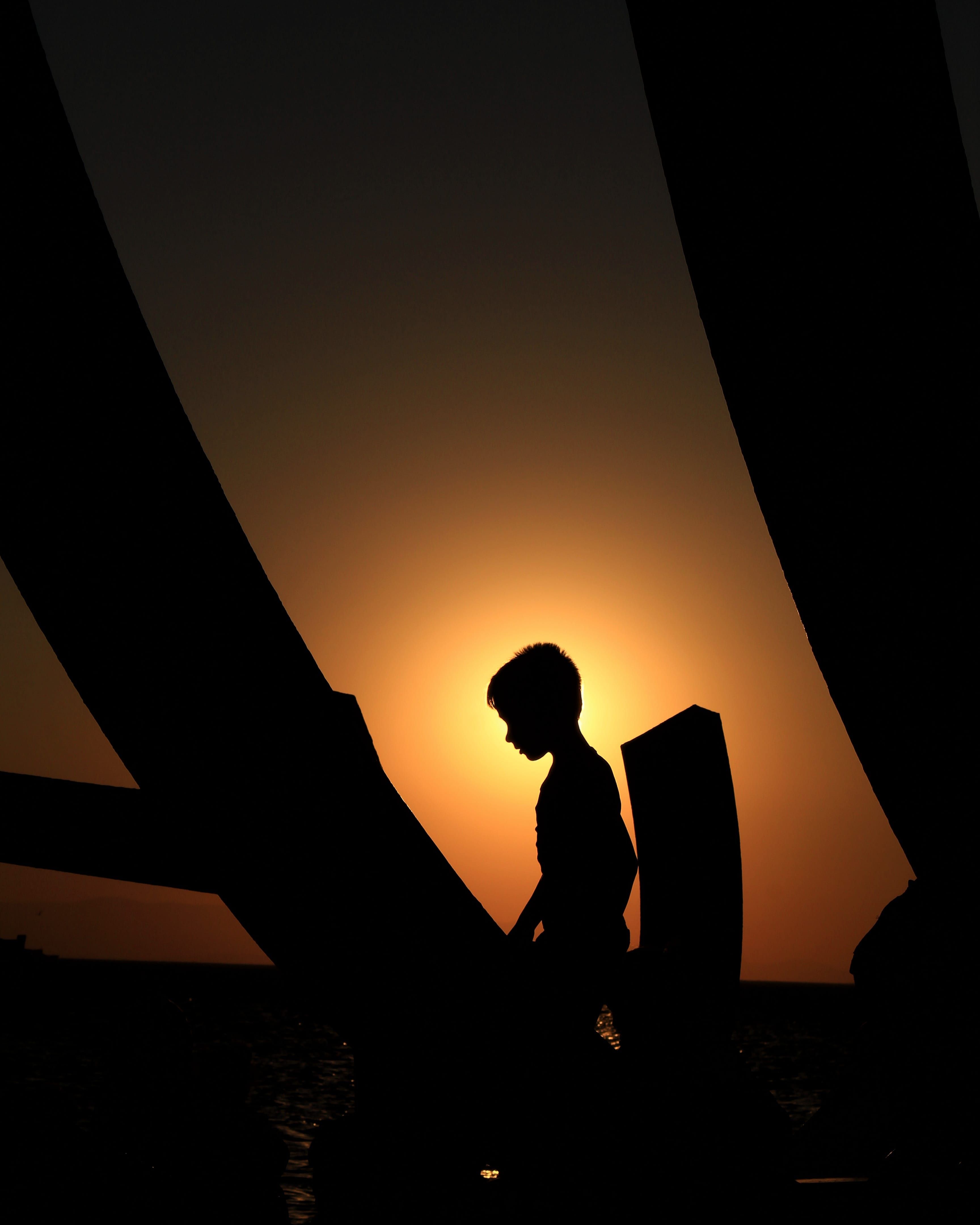 Boy Silhouette at Sunset · Free Stock Photo