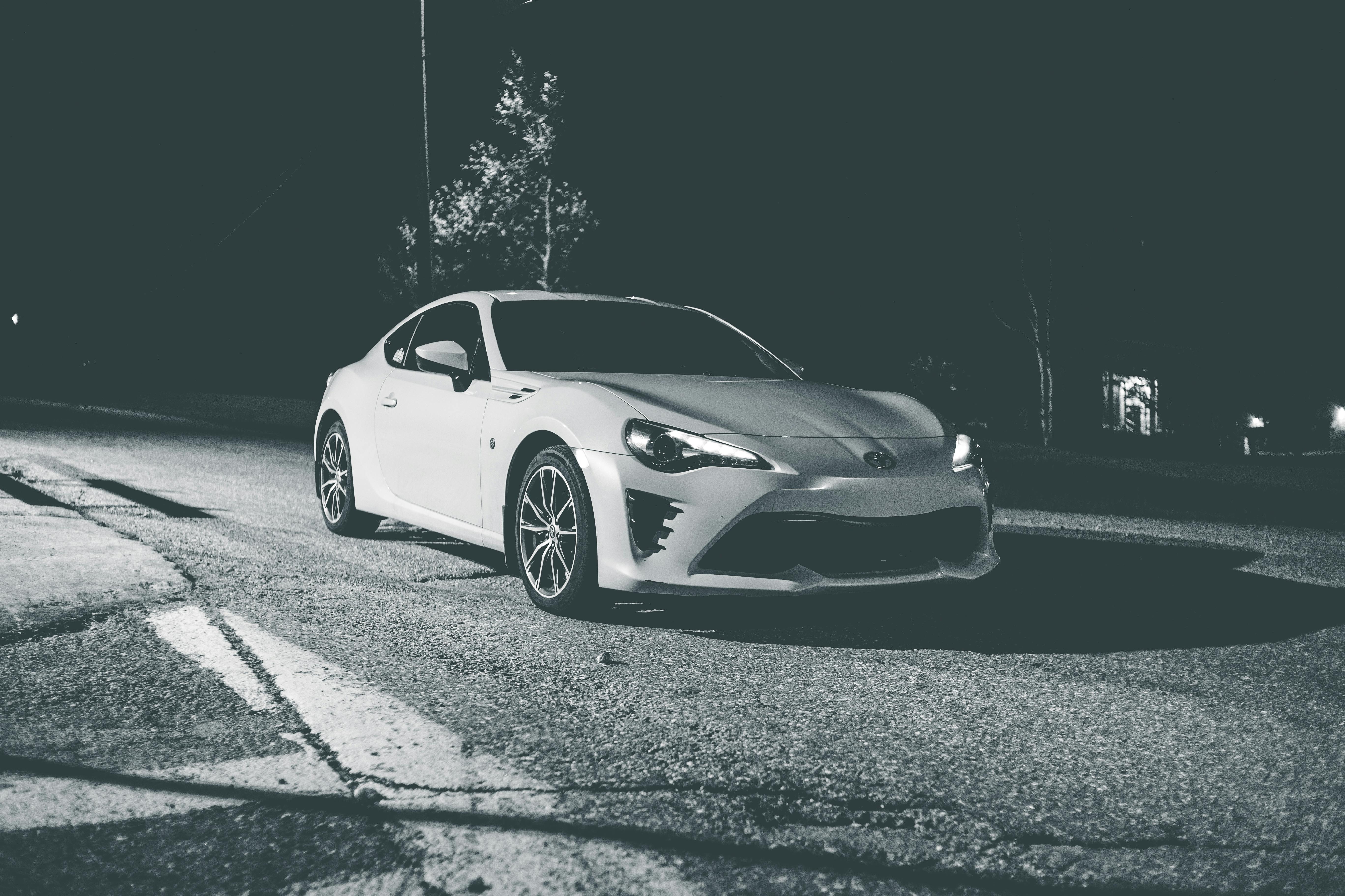 Modern white car on street at night · Free Stock Photo