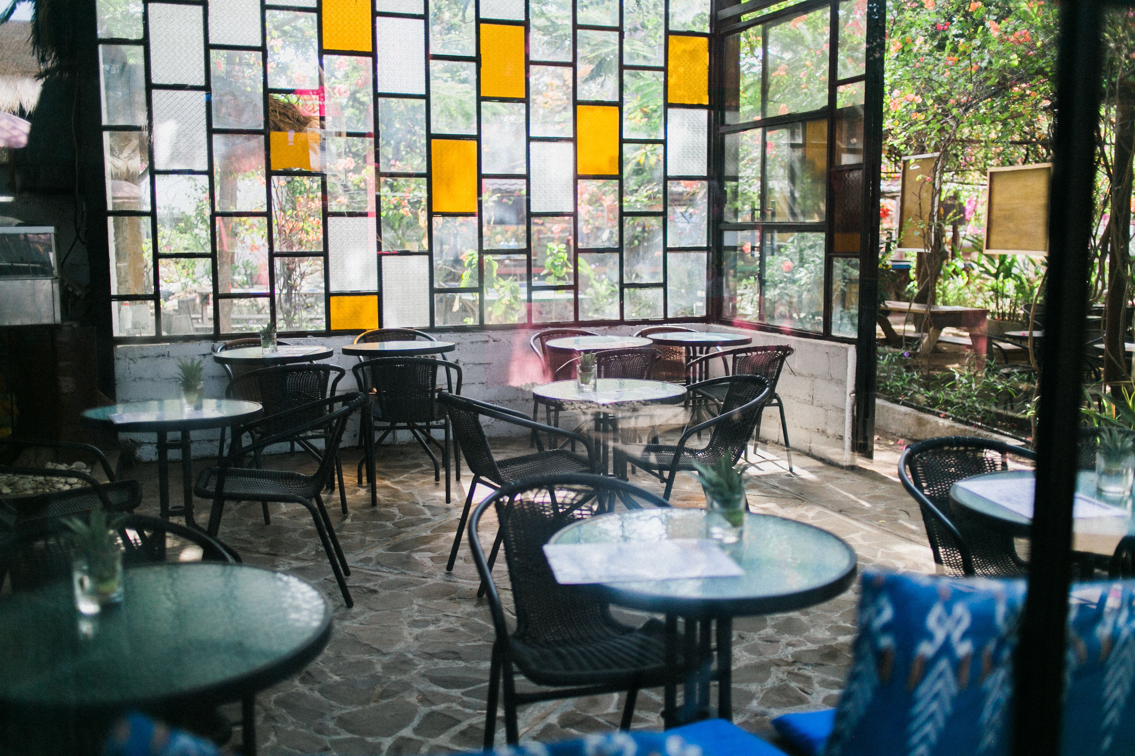 Tables in cafe in daytime · Free Stock Photo