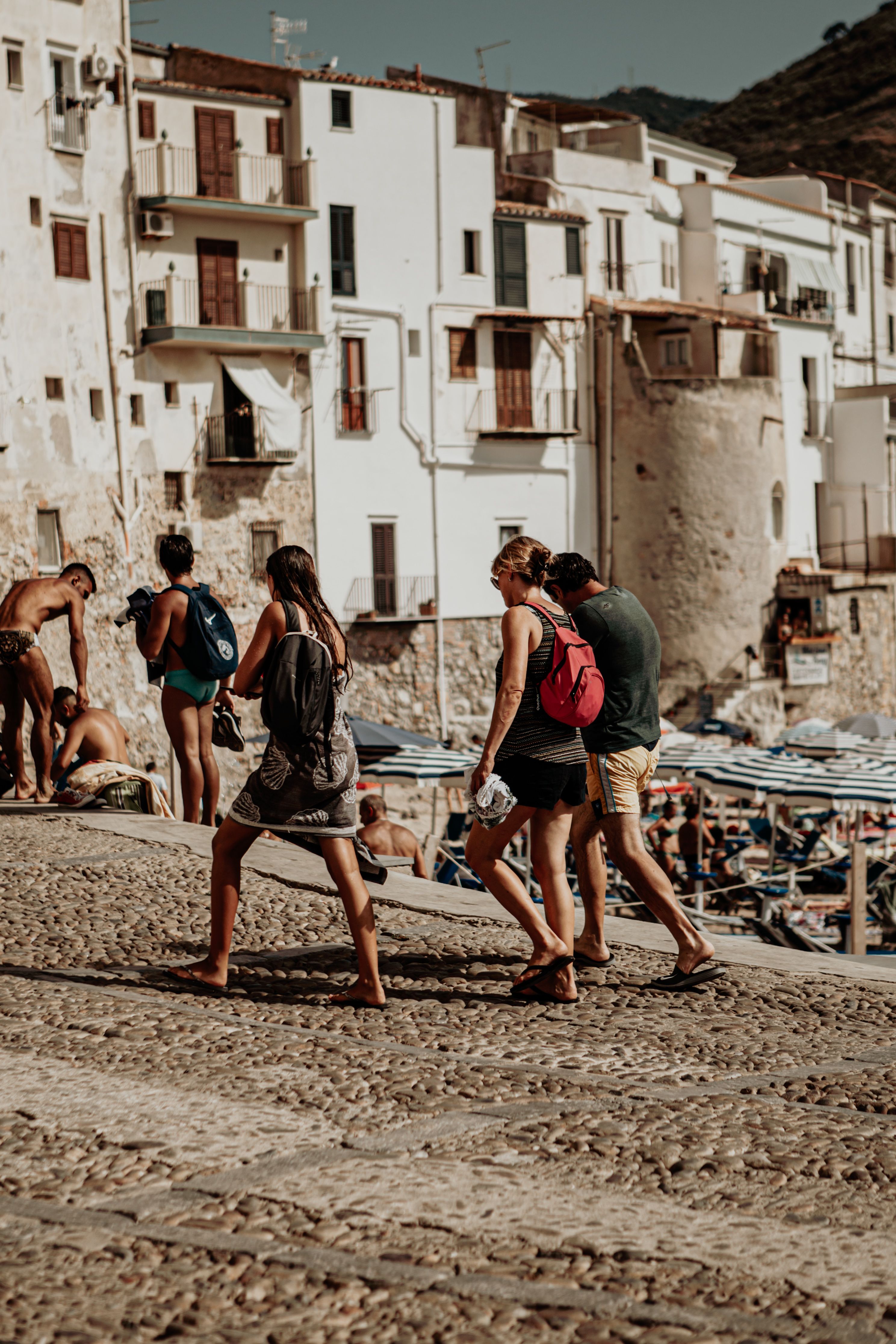 Crop faceless people walking on creative pavement · Free Stock Photo