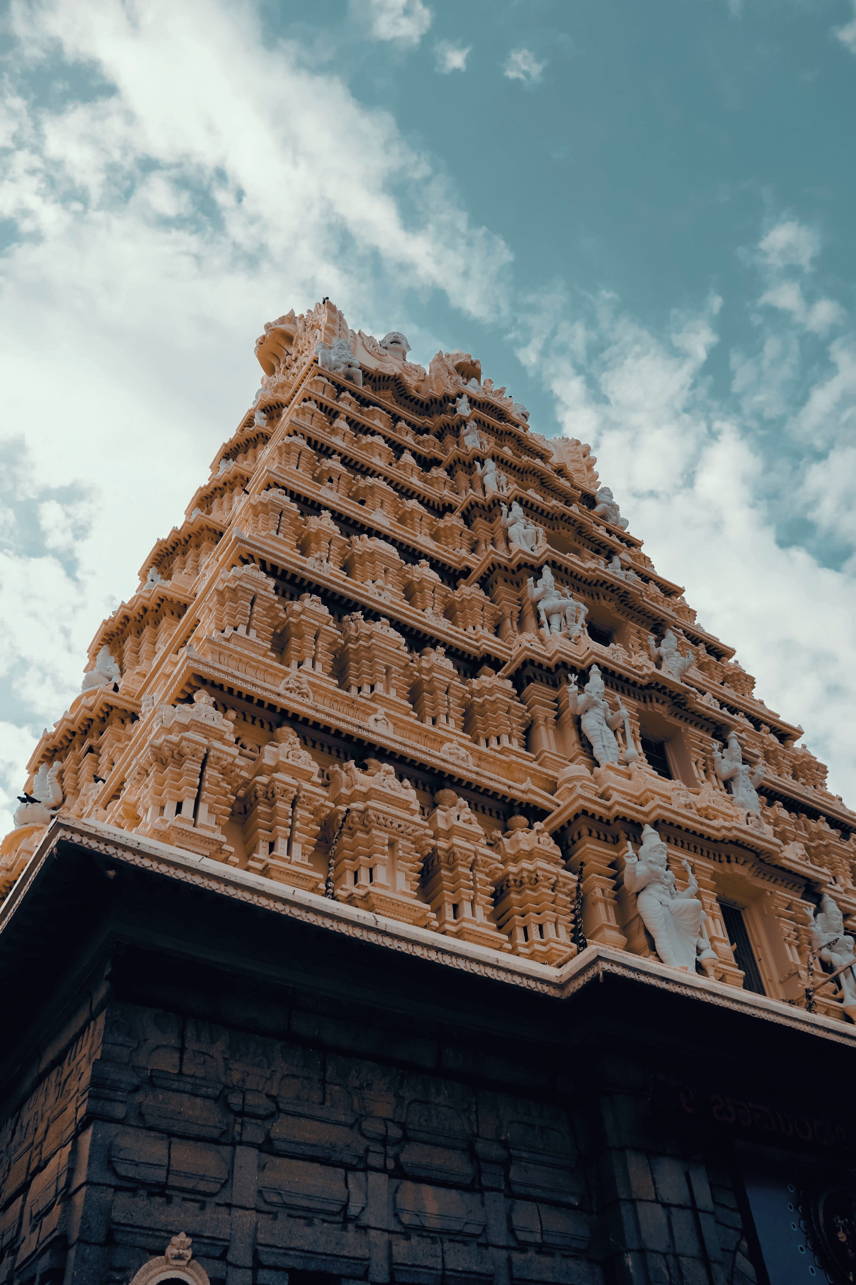 Facade of ancient Hindu temple with ornamental decor · Free Stock Photo