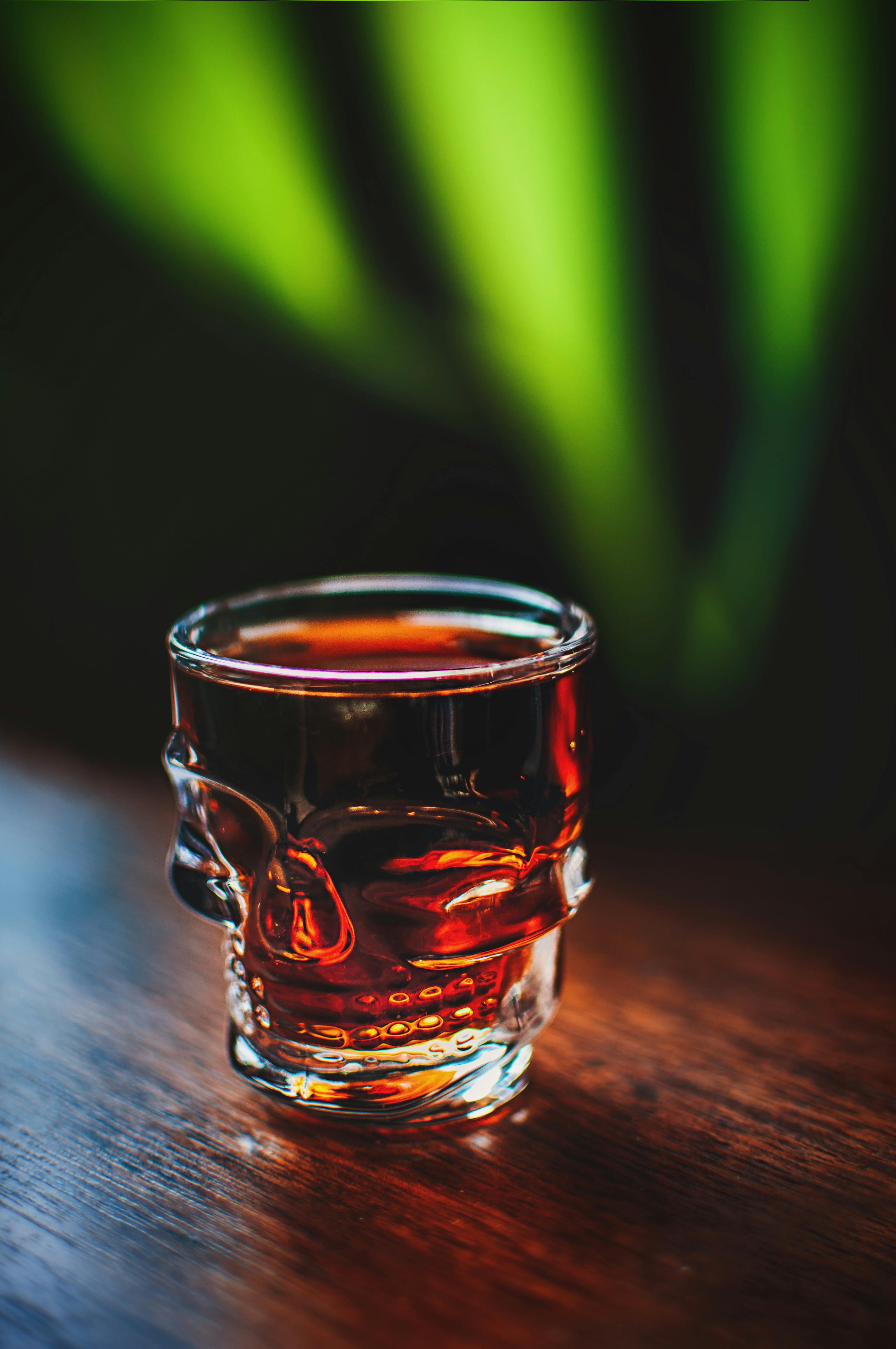Clear Shot Glass With Brown Liquid · Free Stock Photo