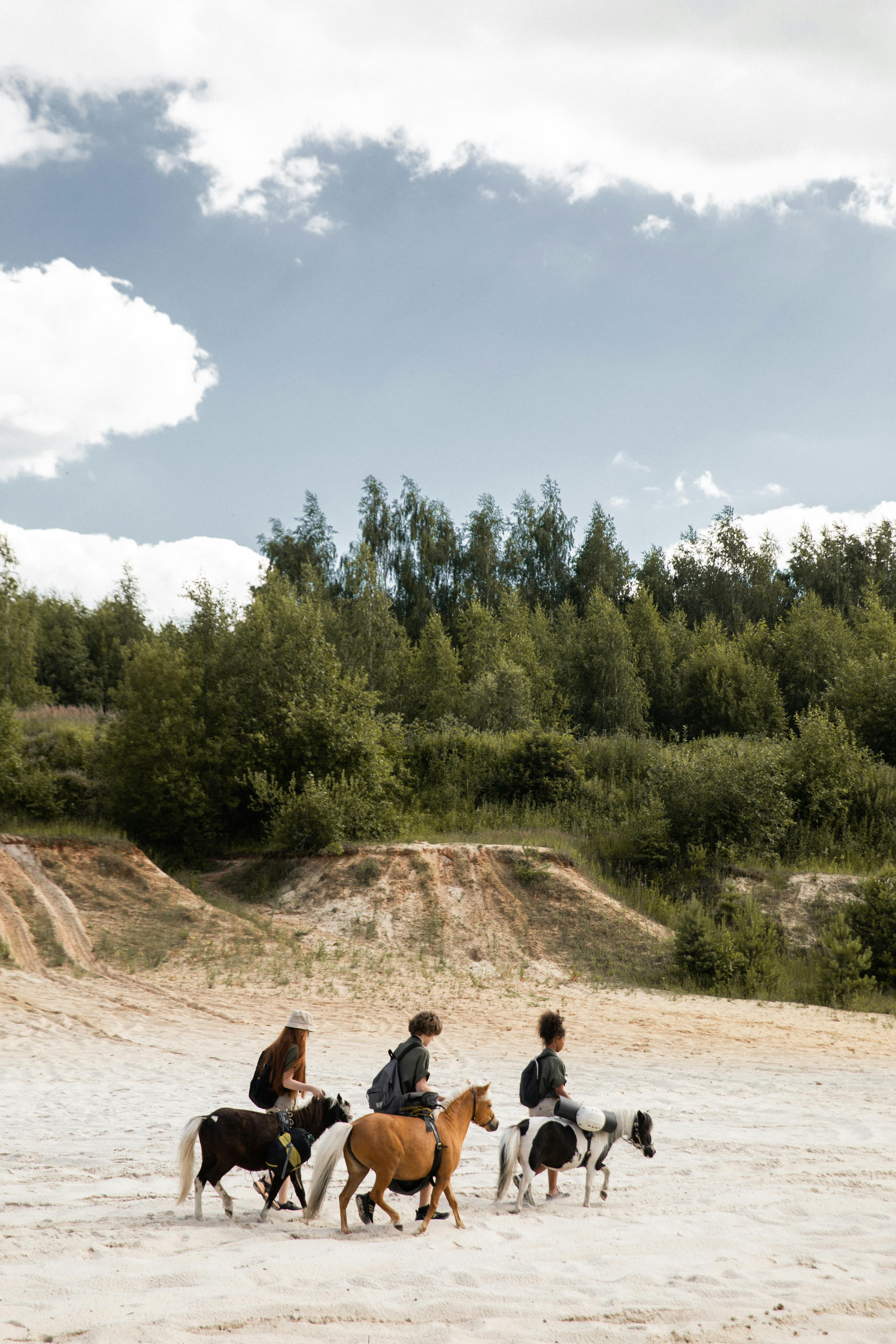 Children Riding on Ponies on a Beach · Free Stock Photo
