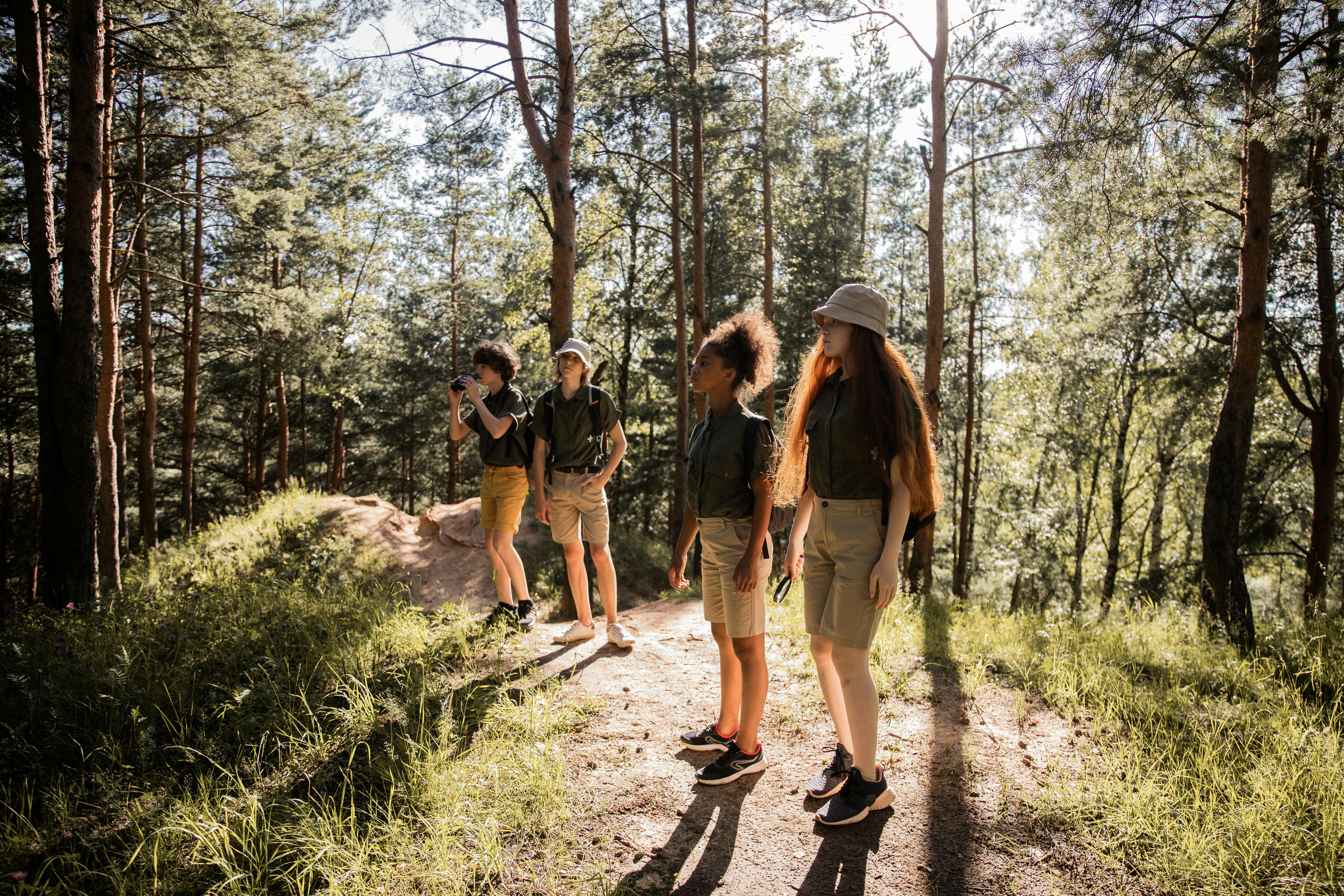 Scouts in Khaki Shirts Standing in a Forest · Free Stock Photo