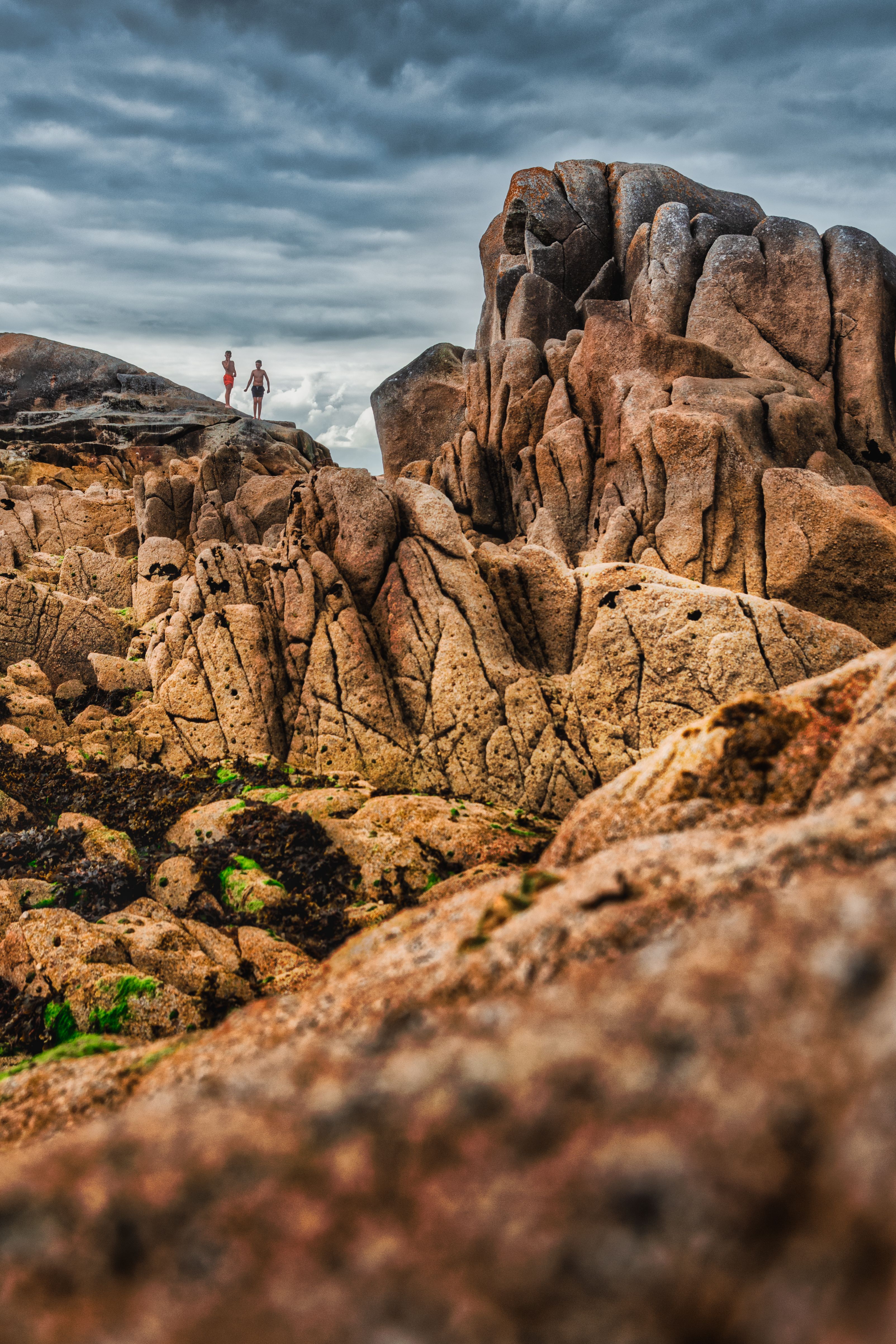 Two People Standing on Top of the Rock Formation · Free Stock Photo