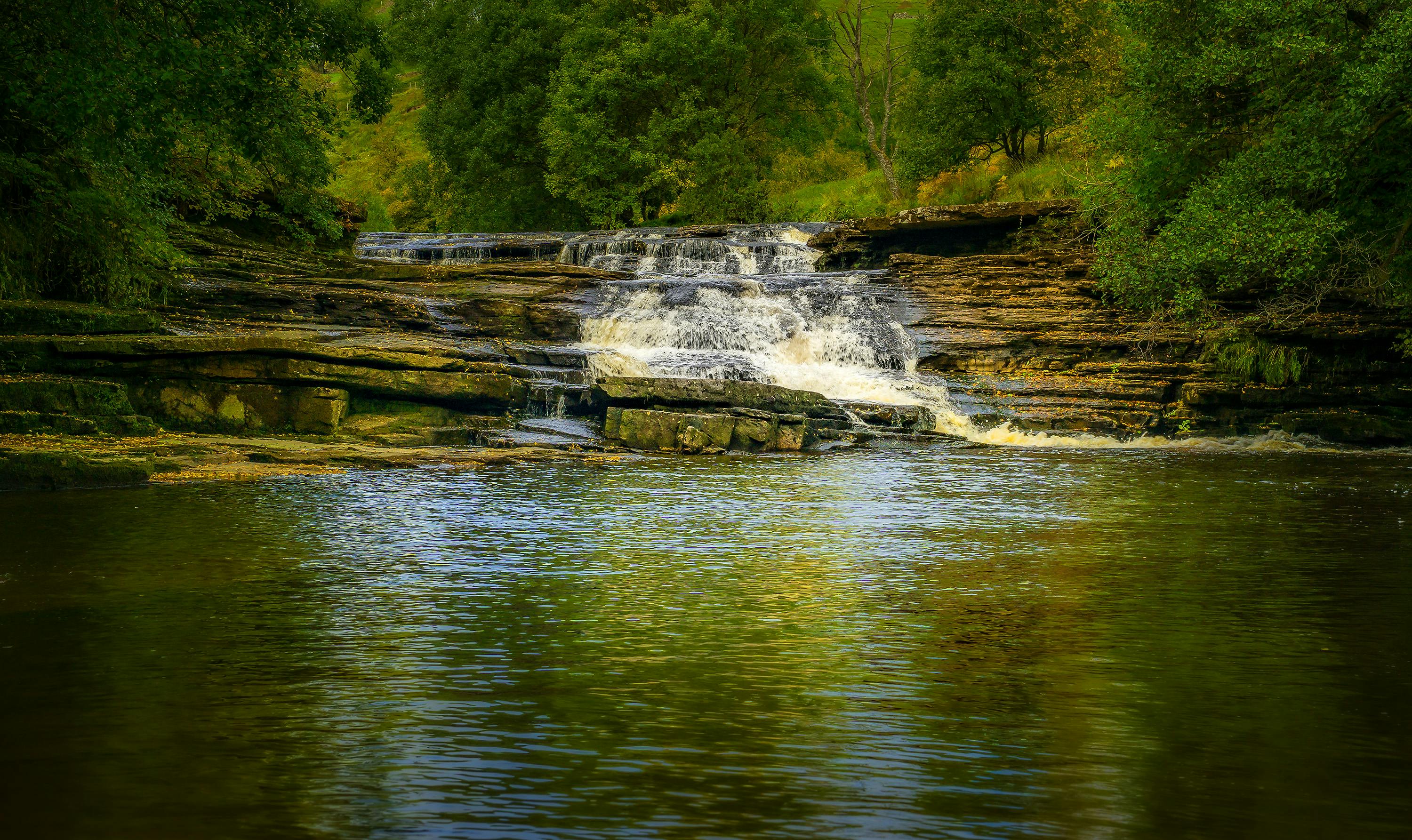 Raging River Surrounded by Stones · Free Stock Photo