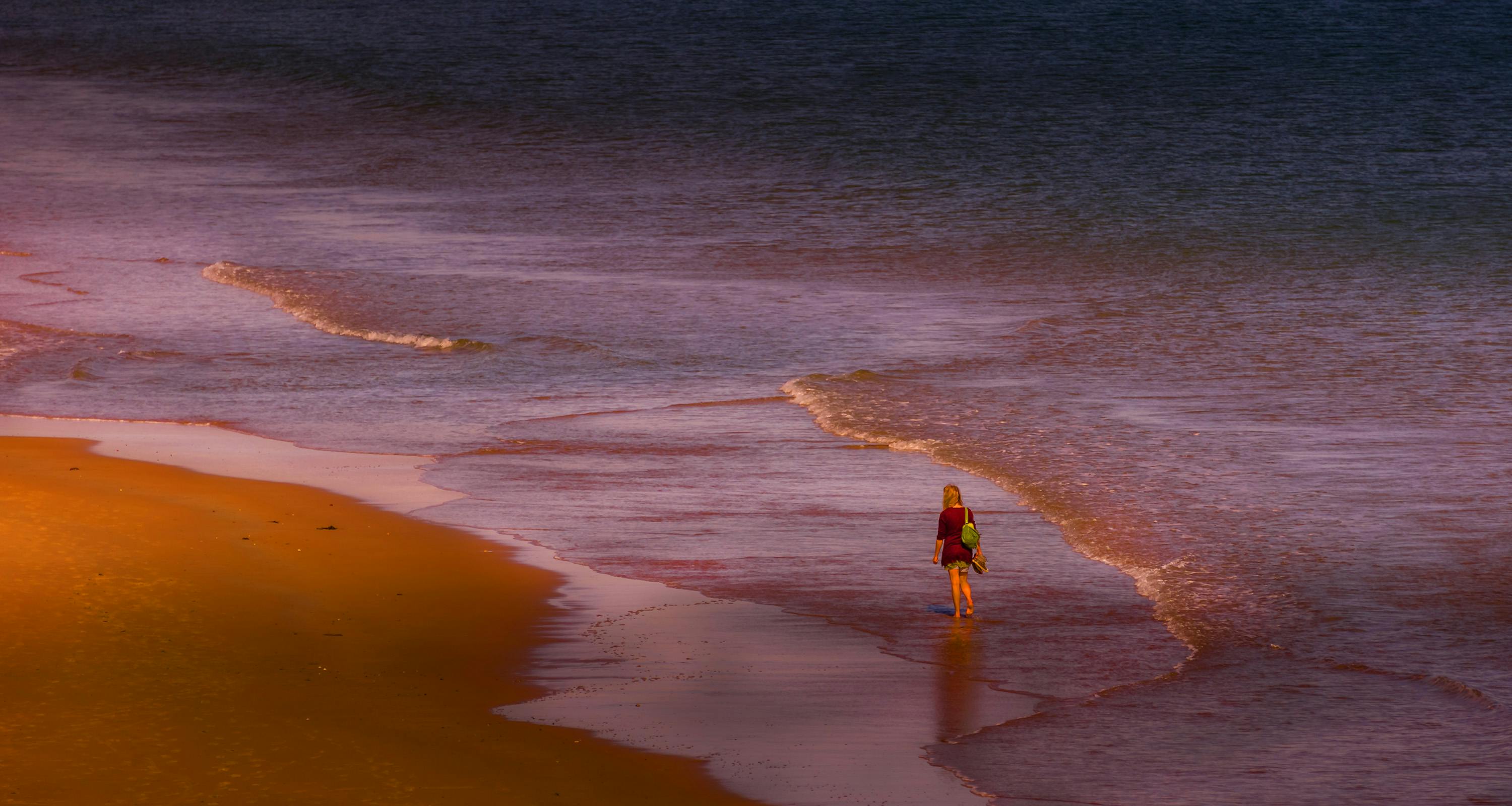 Woman in a Dress Walking into the Sea · Free Stock Photo