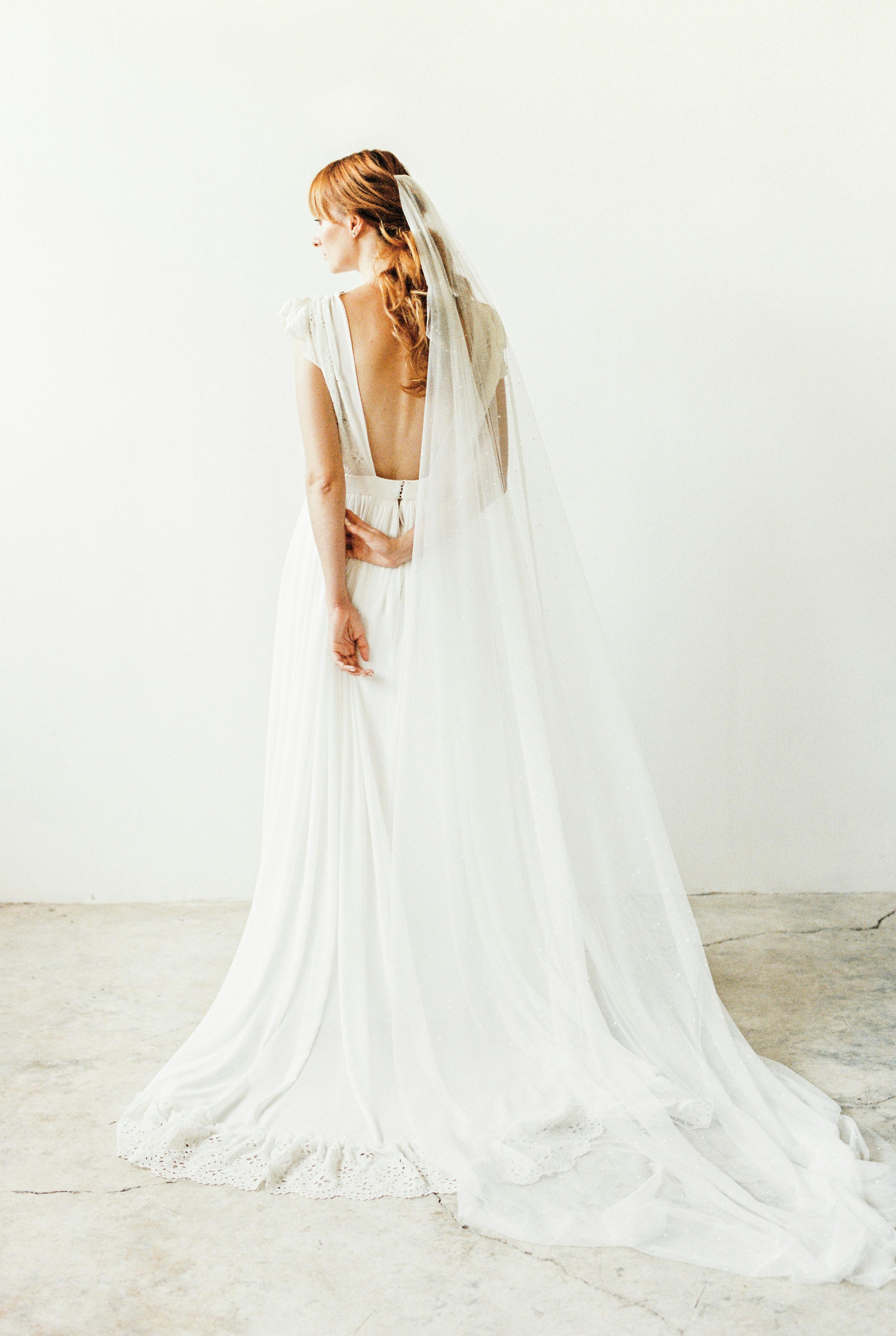 Woman in White Backless Wedding Dress with Drape Veil · Free Stock Photo