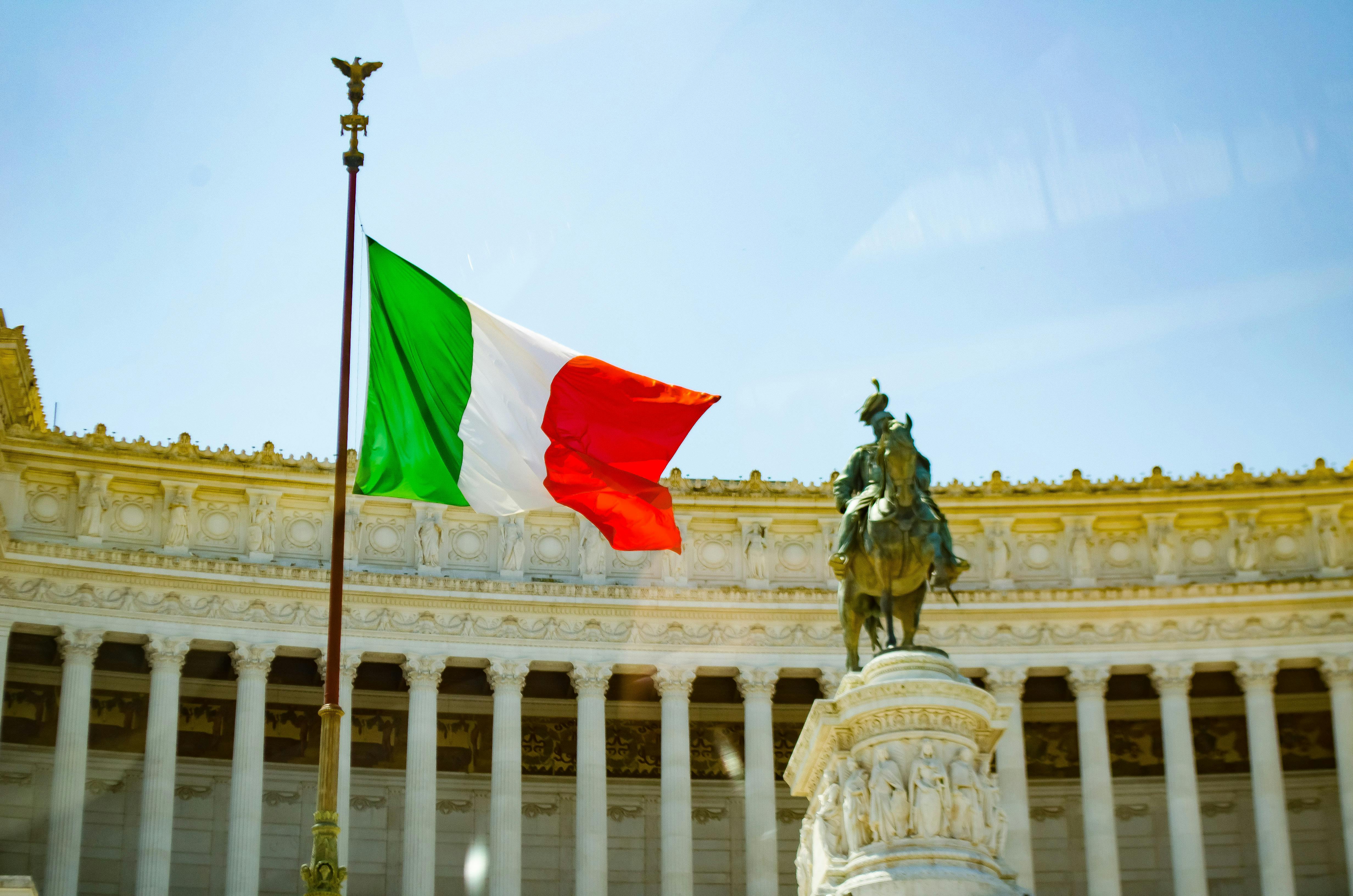 Italian Flag and a Colonnade in the Background · Free Stock Photo