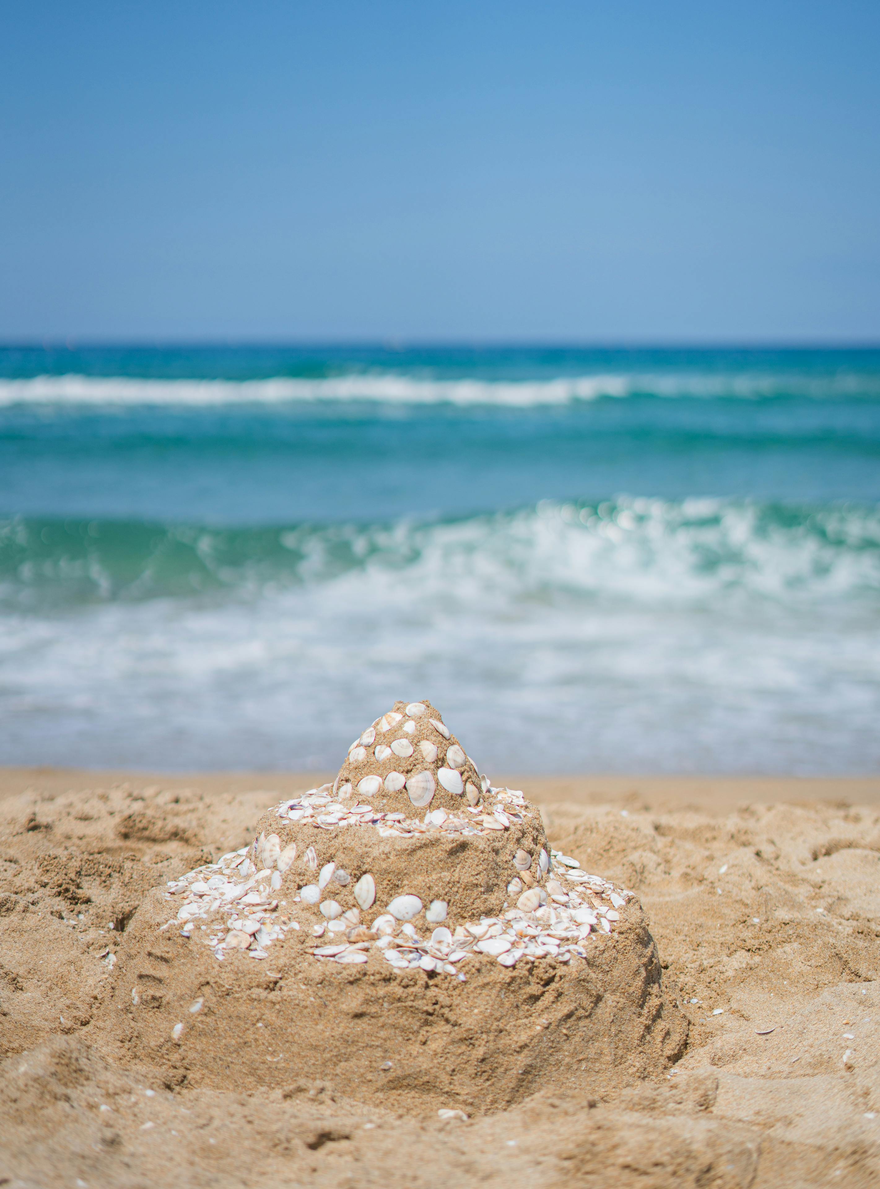 A Sand Castle Near the Ocean · Free Stock Photo