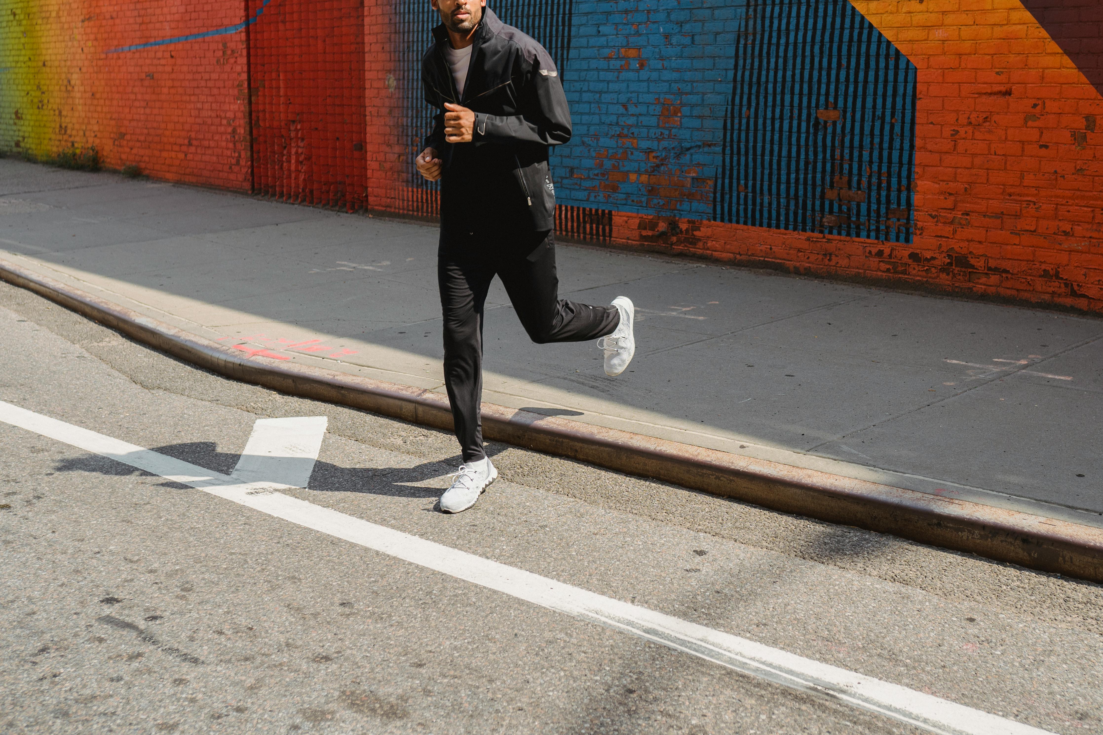 Man Jogging on the Sidewalk · Free Stock Photo