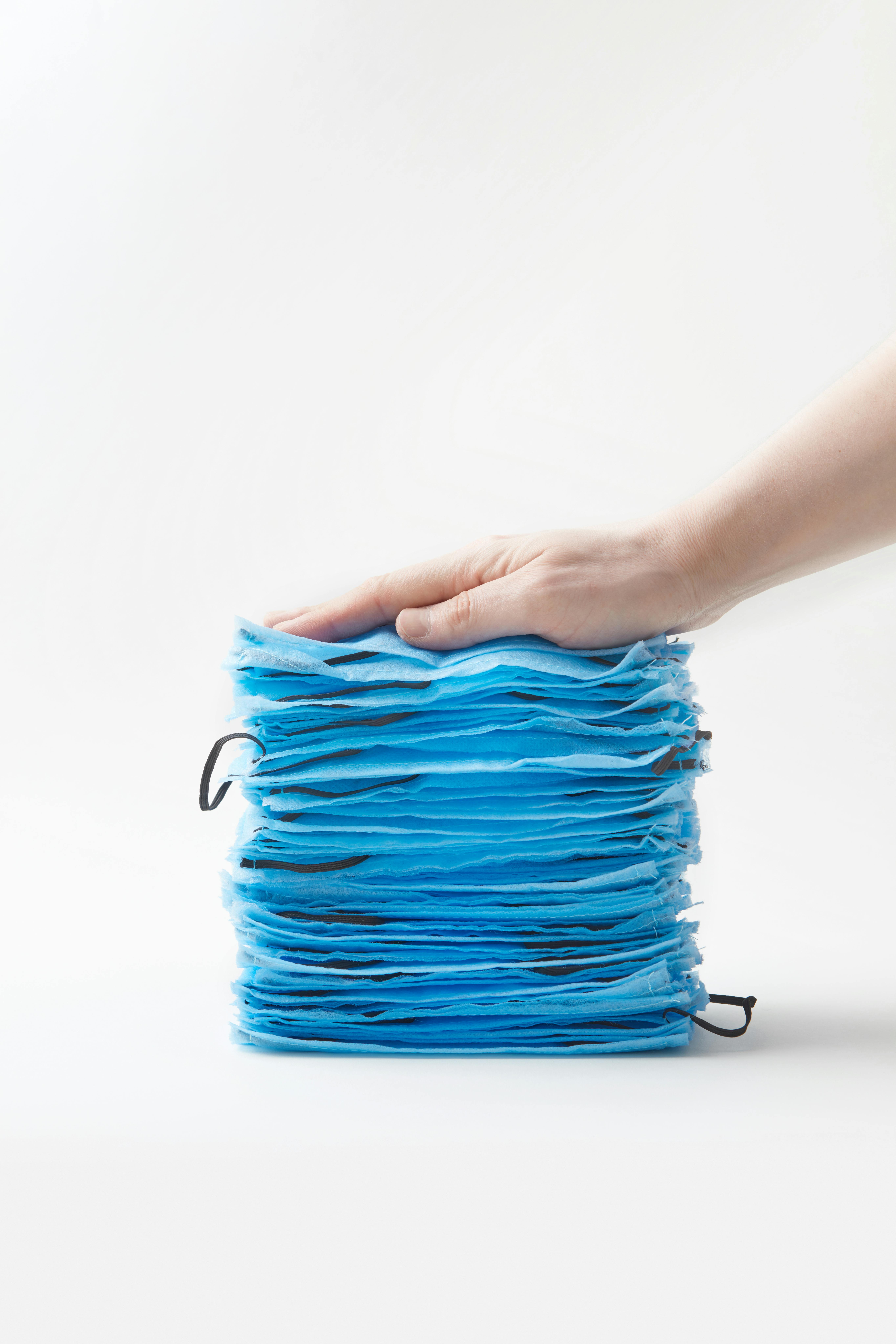 Stack of Blue Face Masks · Free Stock Photo