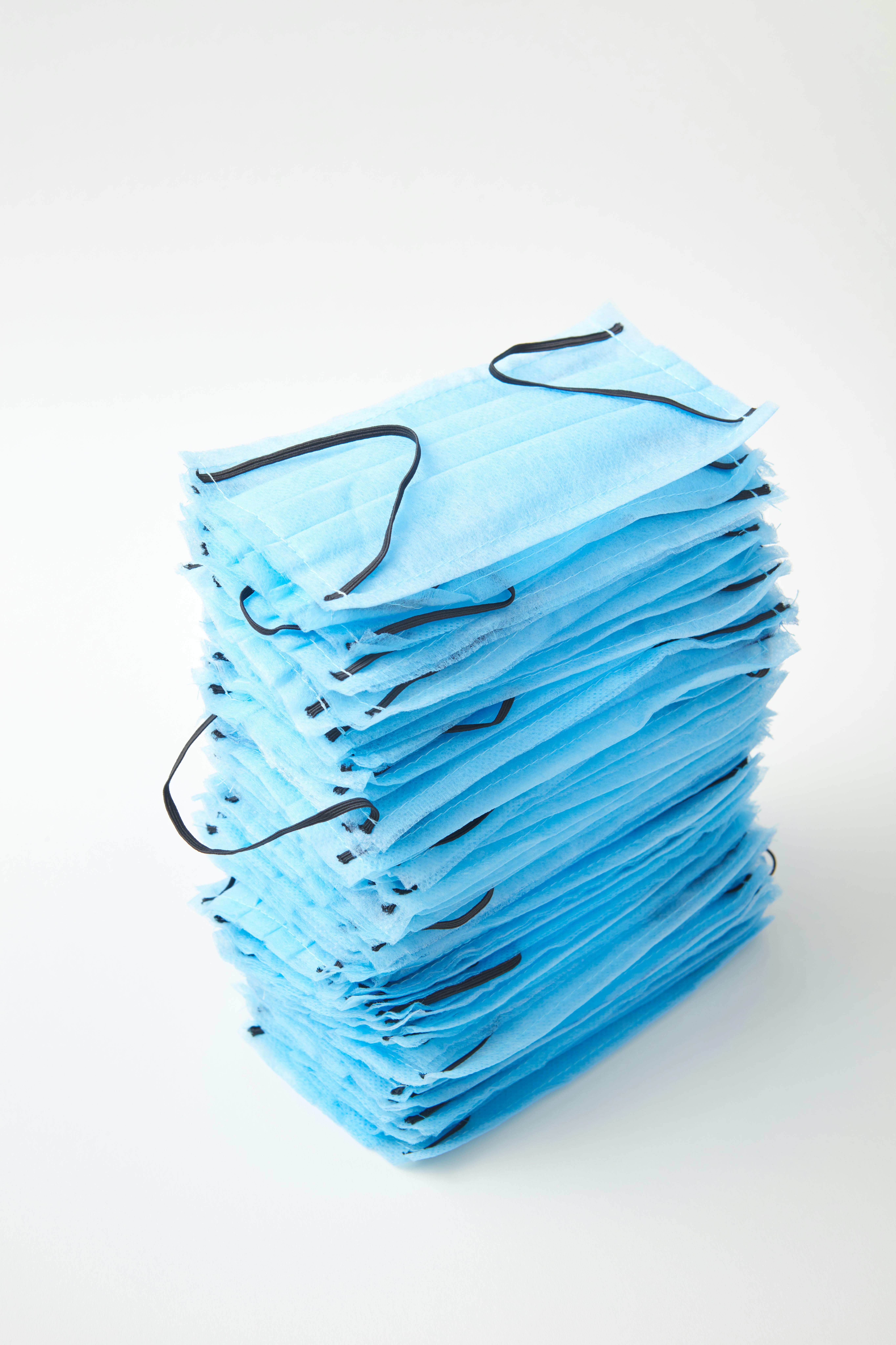 Stack of Blue Face Masks · Free Stock Photo