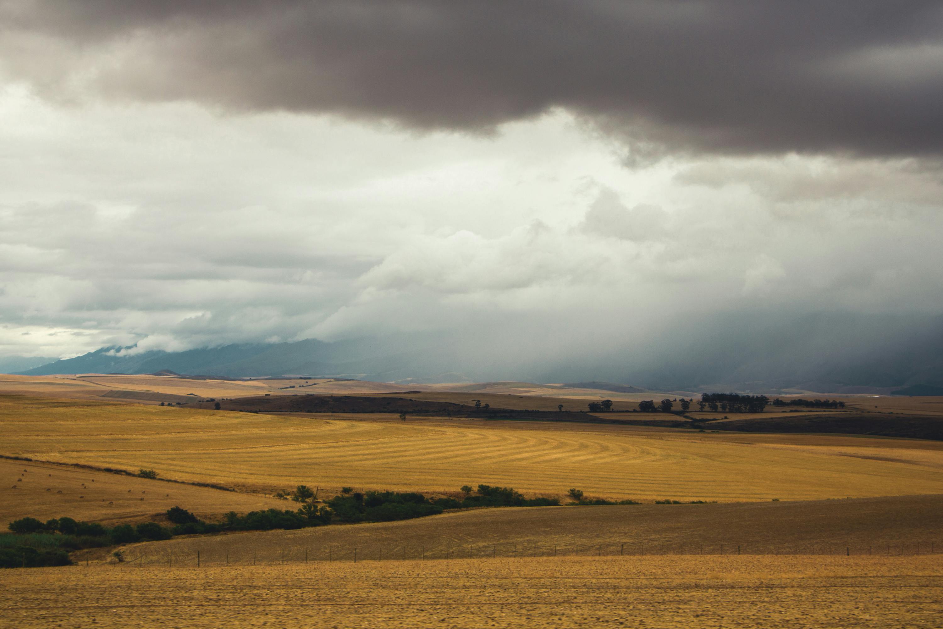 Rural Landscape under a Storm Cloud · Free Stock Photo