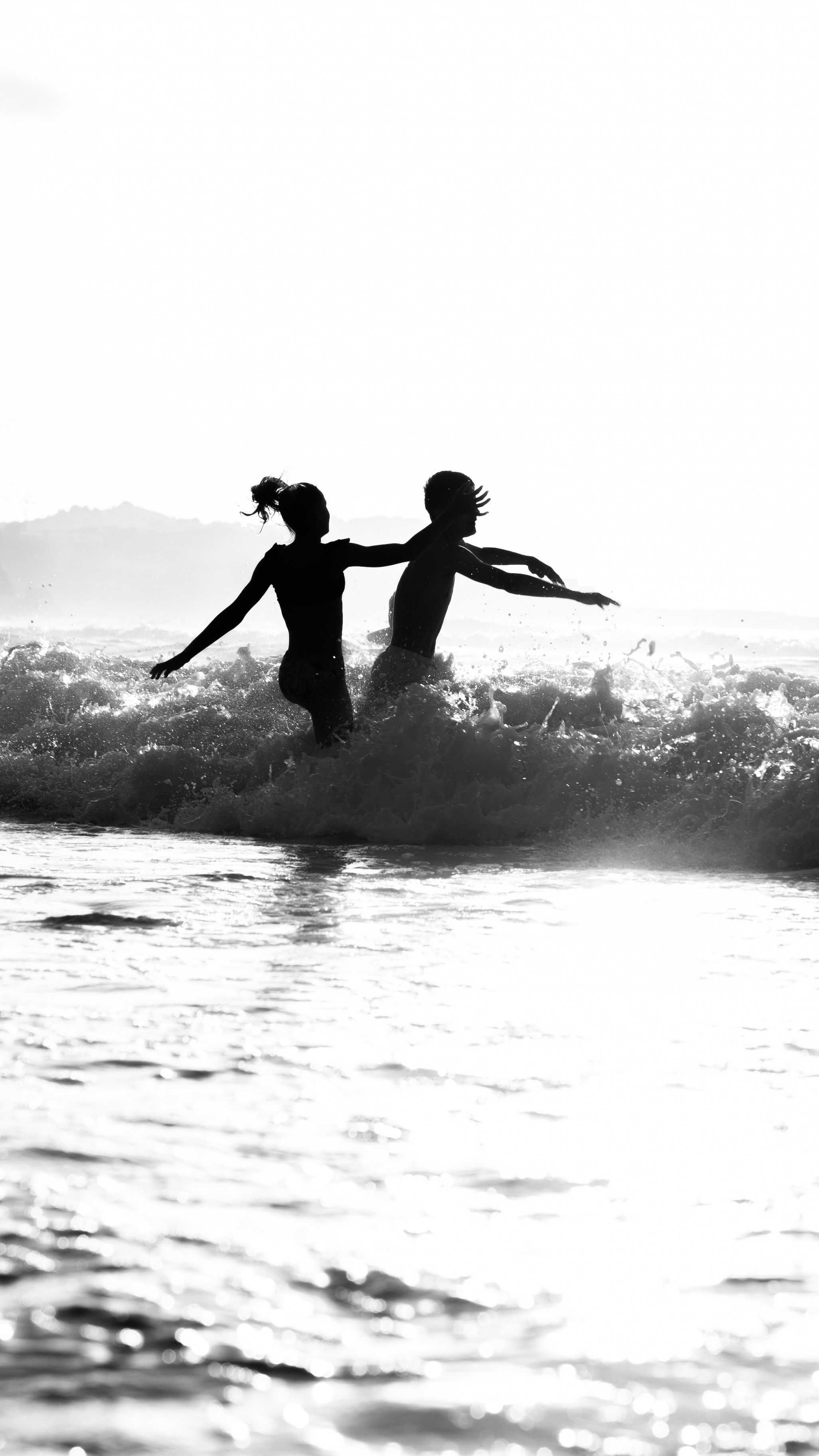 Women Running into the Sea · Free Stock Photo