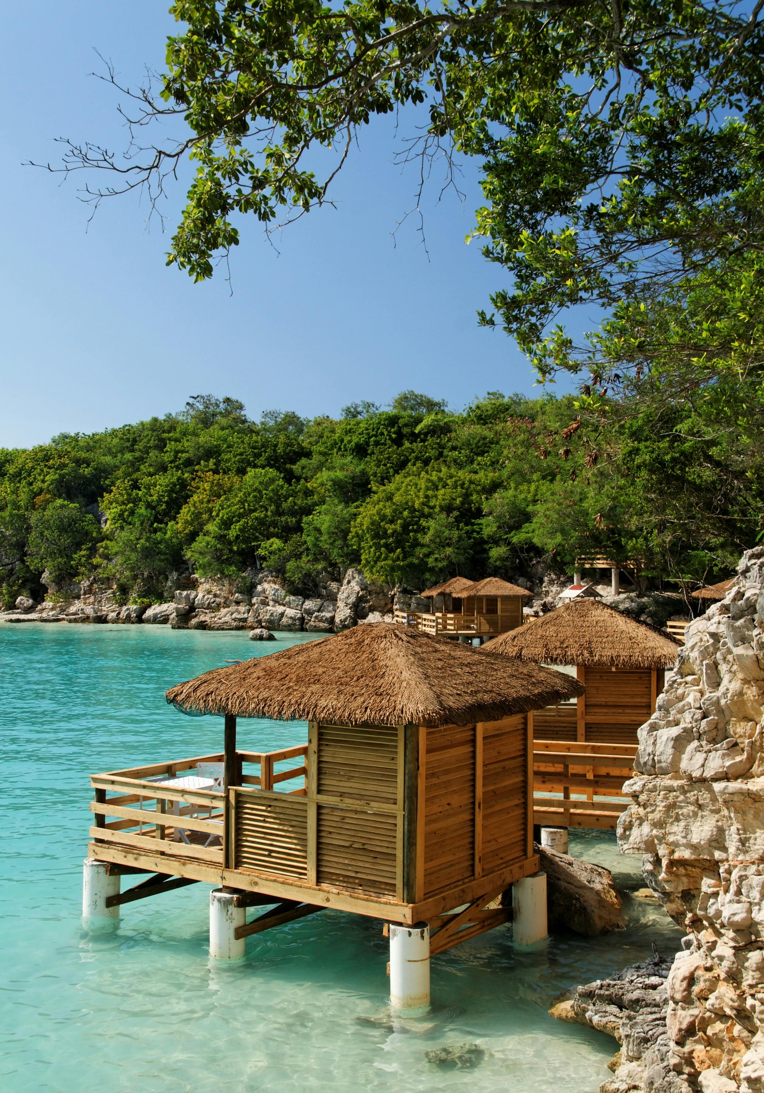 Brown Wooden Hut On Pier · Free Stock Photo