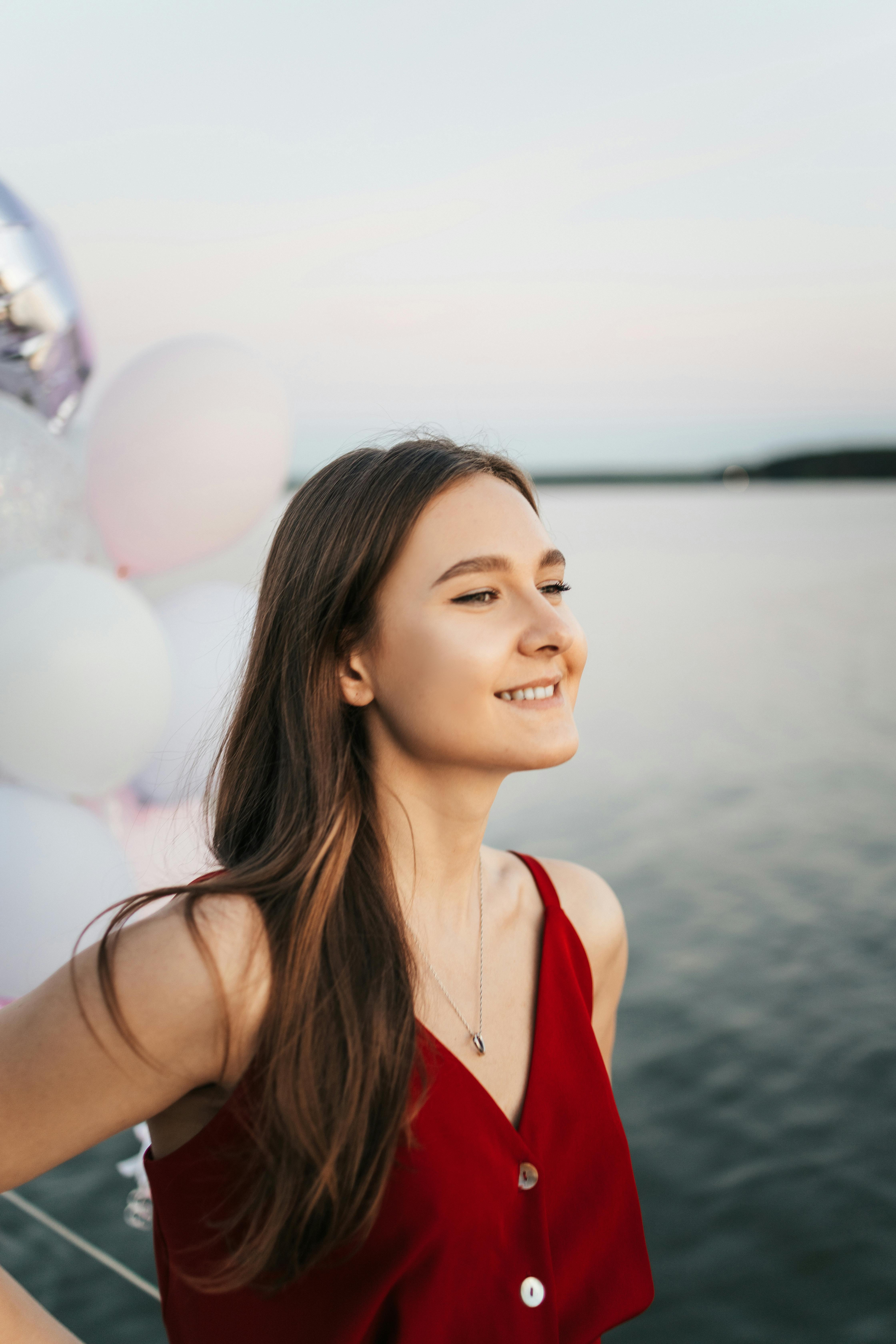 Woman in Red Tank Top Smiling · Free Stock Photo