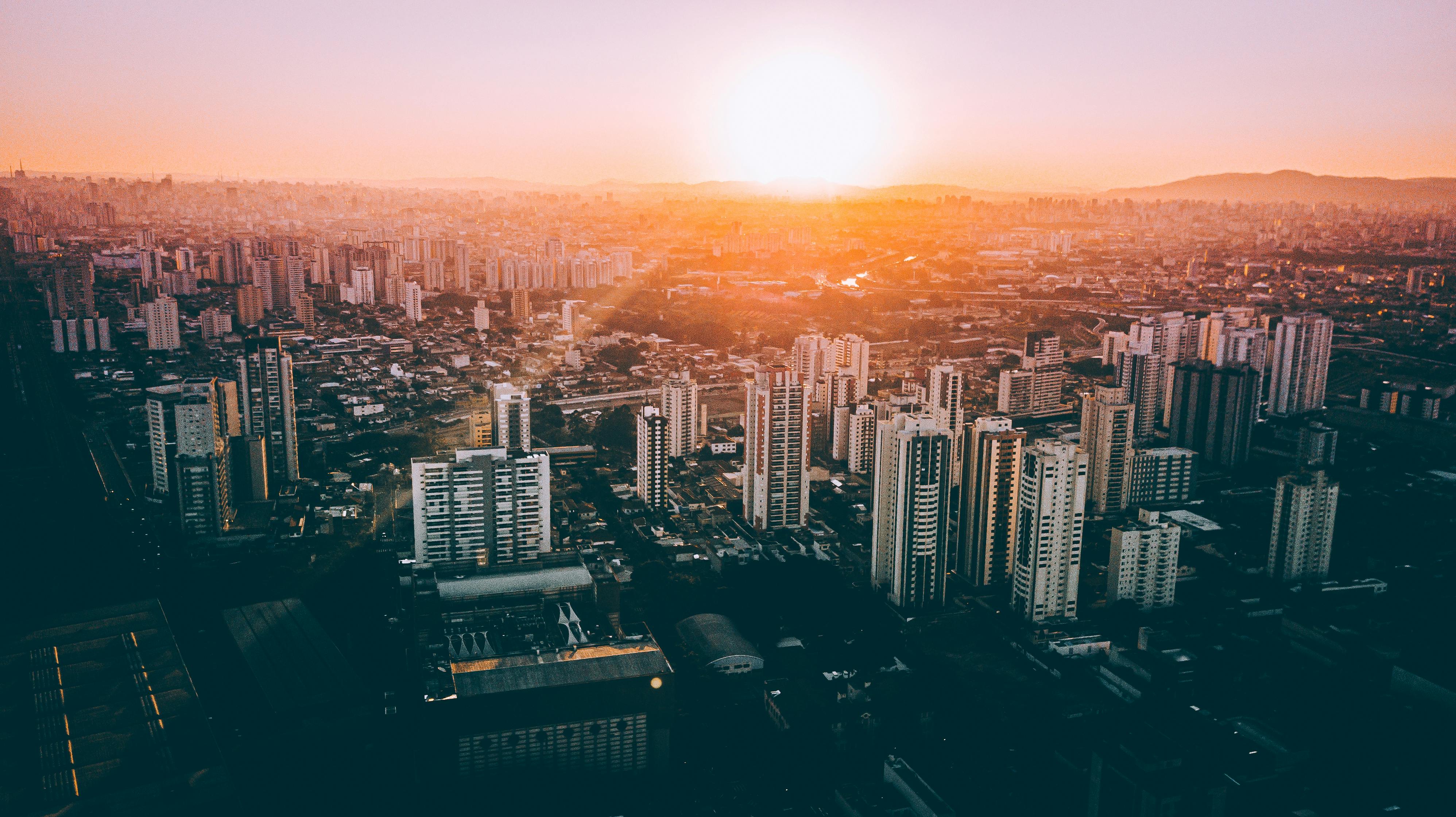 Cityscape with modern buildings and indoor stadium in daylight · Free ...