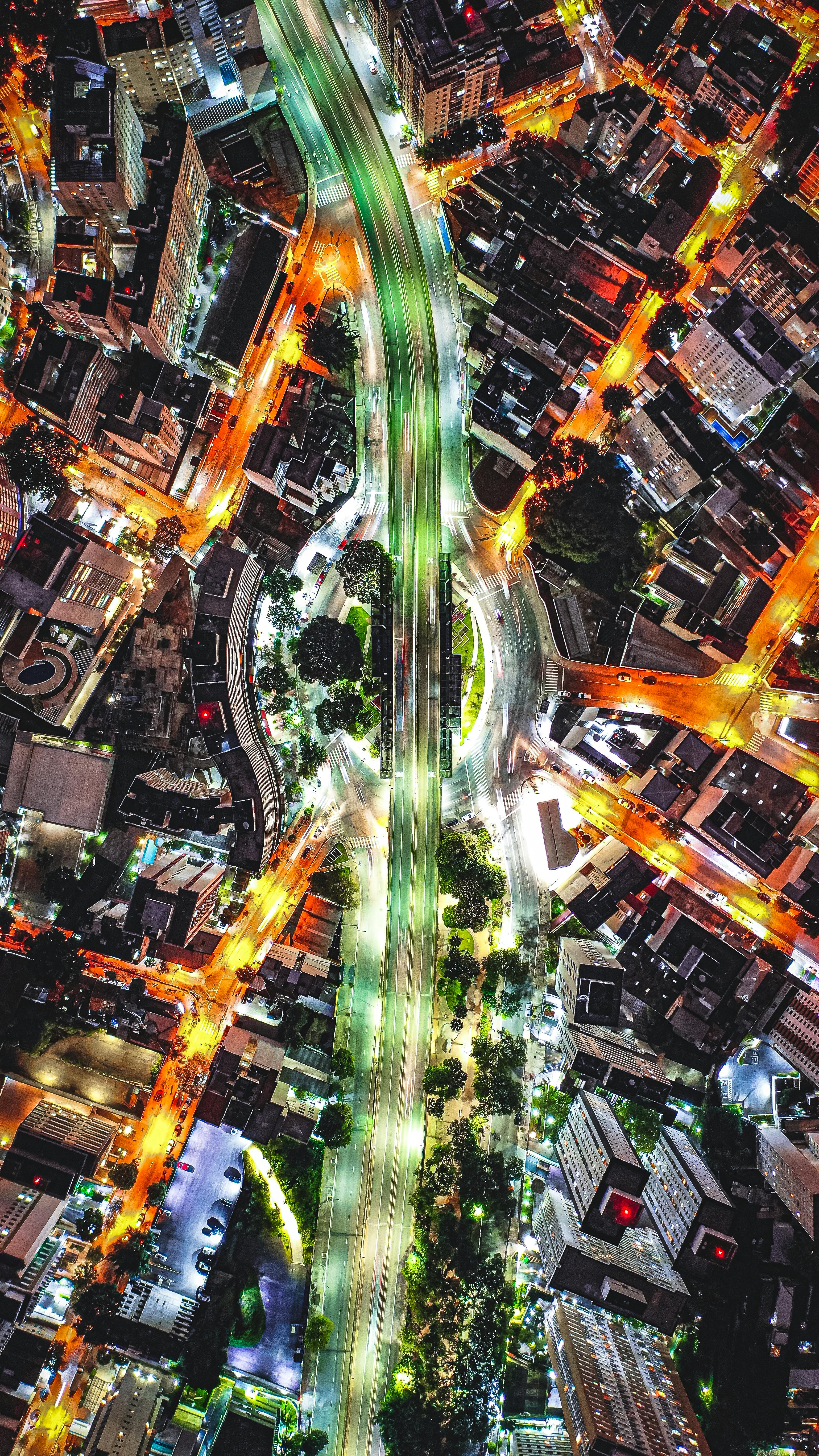 Night sky over illuminated city at night · Free Stock Photo