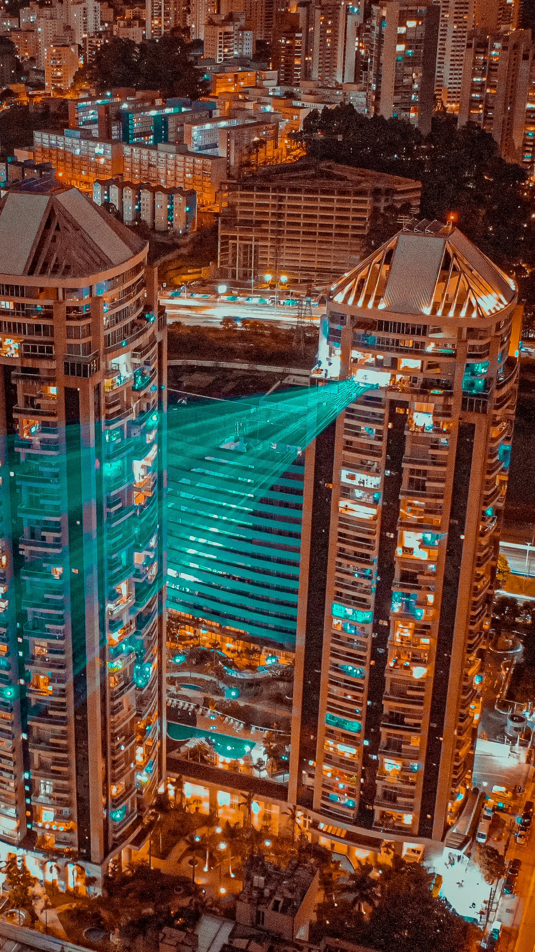 Glowing futuristic skyscrapers in modern megapolis · Free Stock Photo