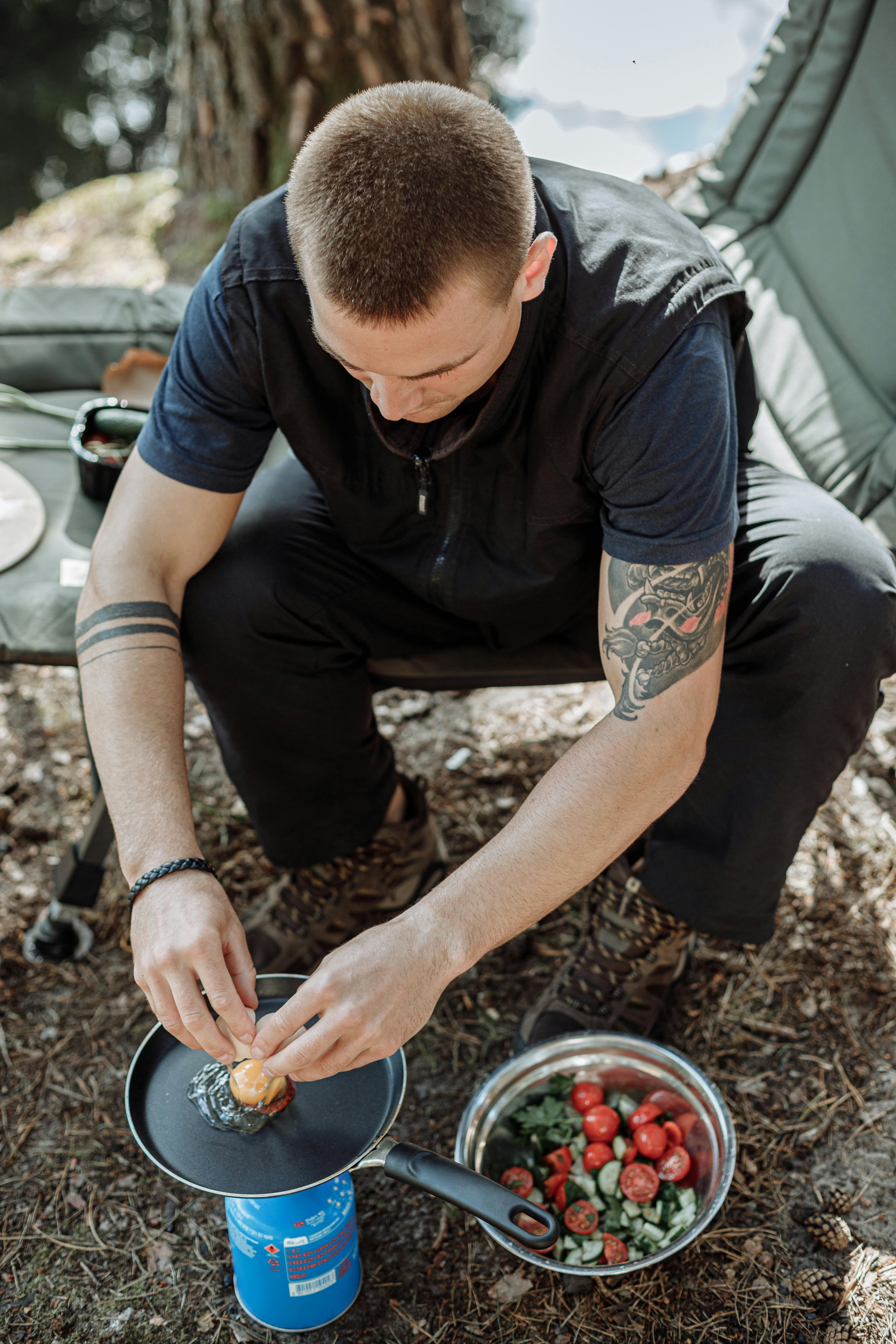 Man Cooking an Egg · Free Stock Photo