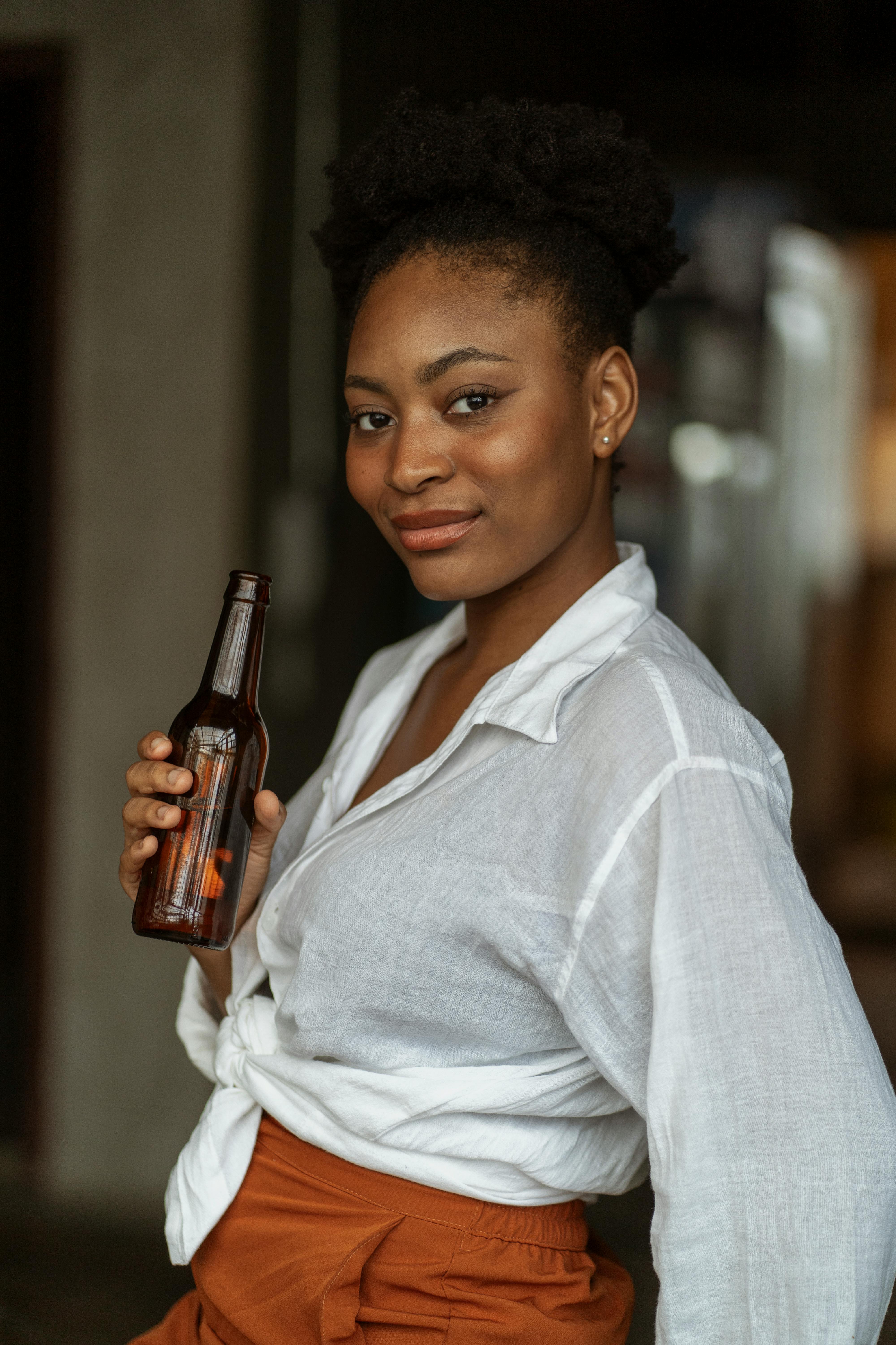 Portrait of a Woman with Beer · Free Stock Photo