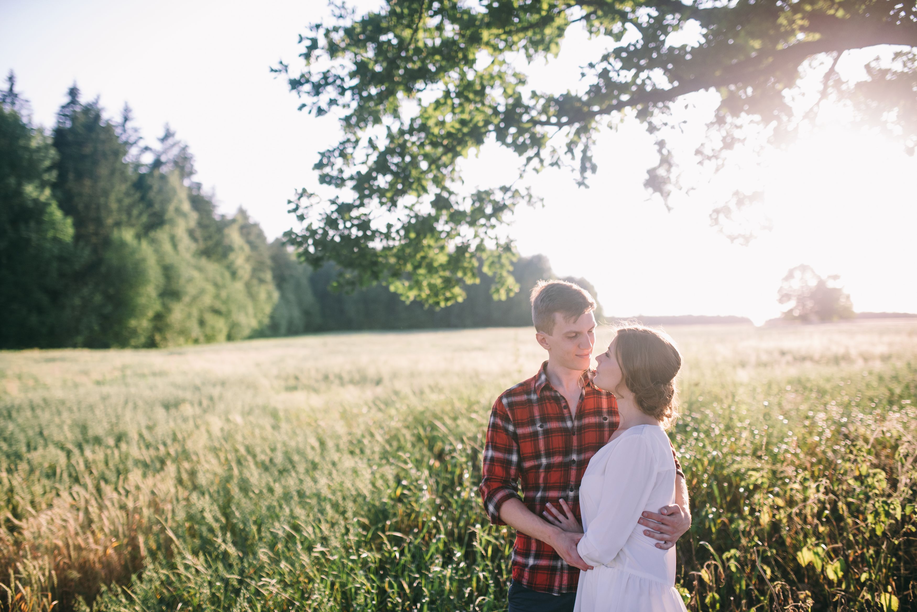 A Couple Standing Under the Tree · Free Stock Photo